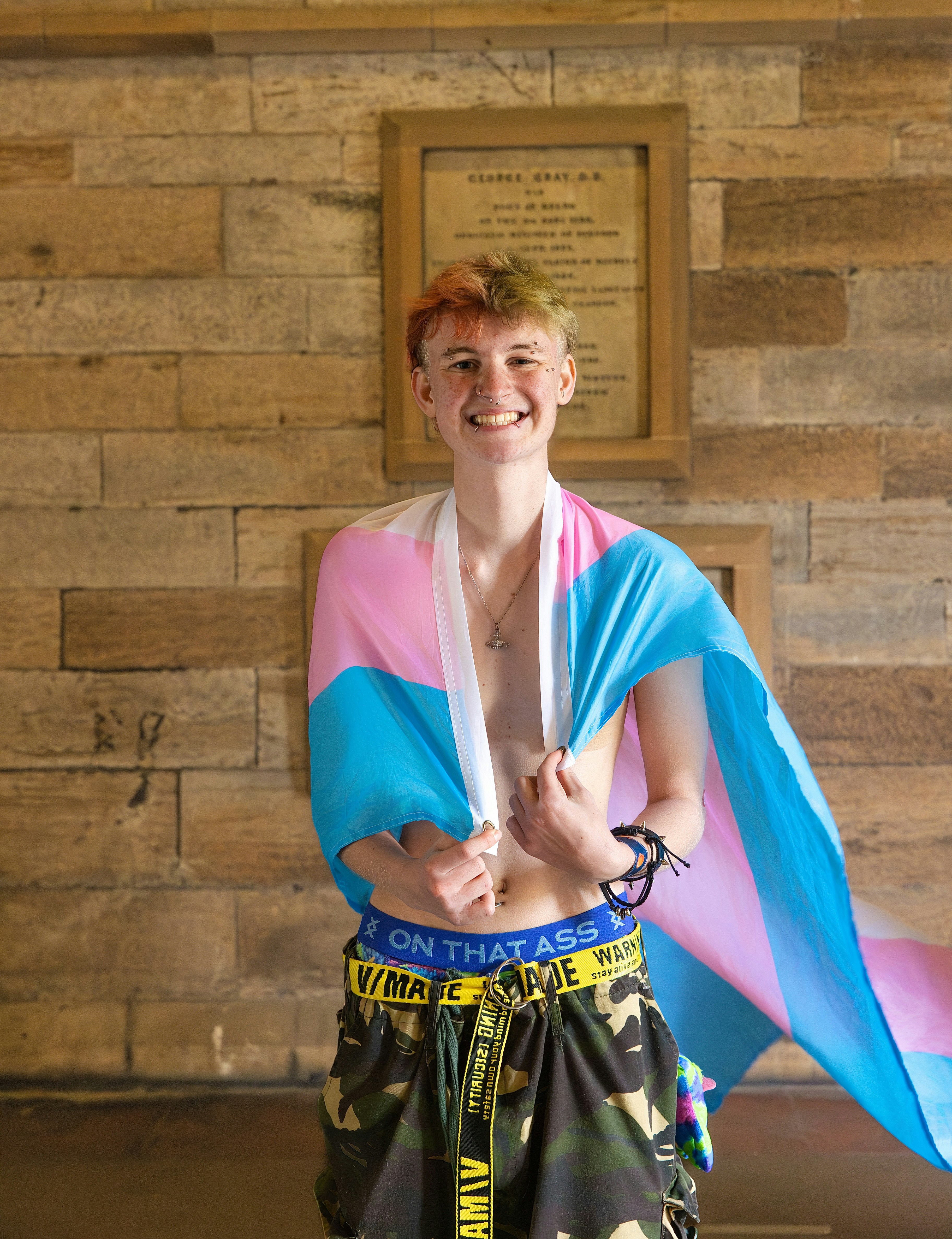 Prideful Portrait: A joyful reveal beneath a colorful scarf