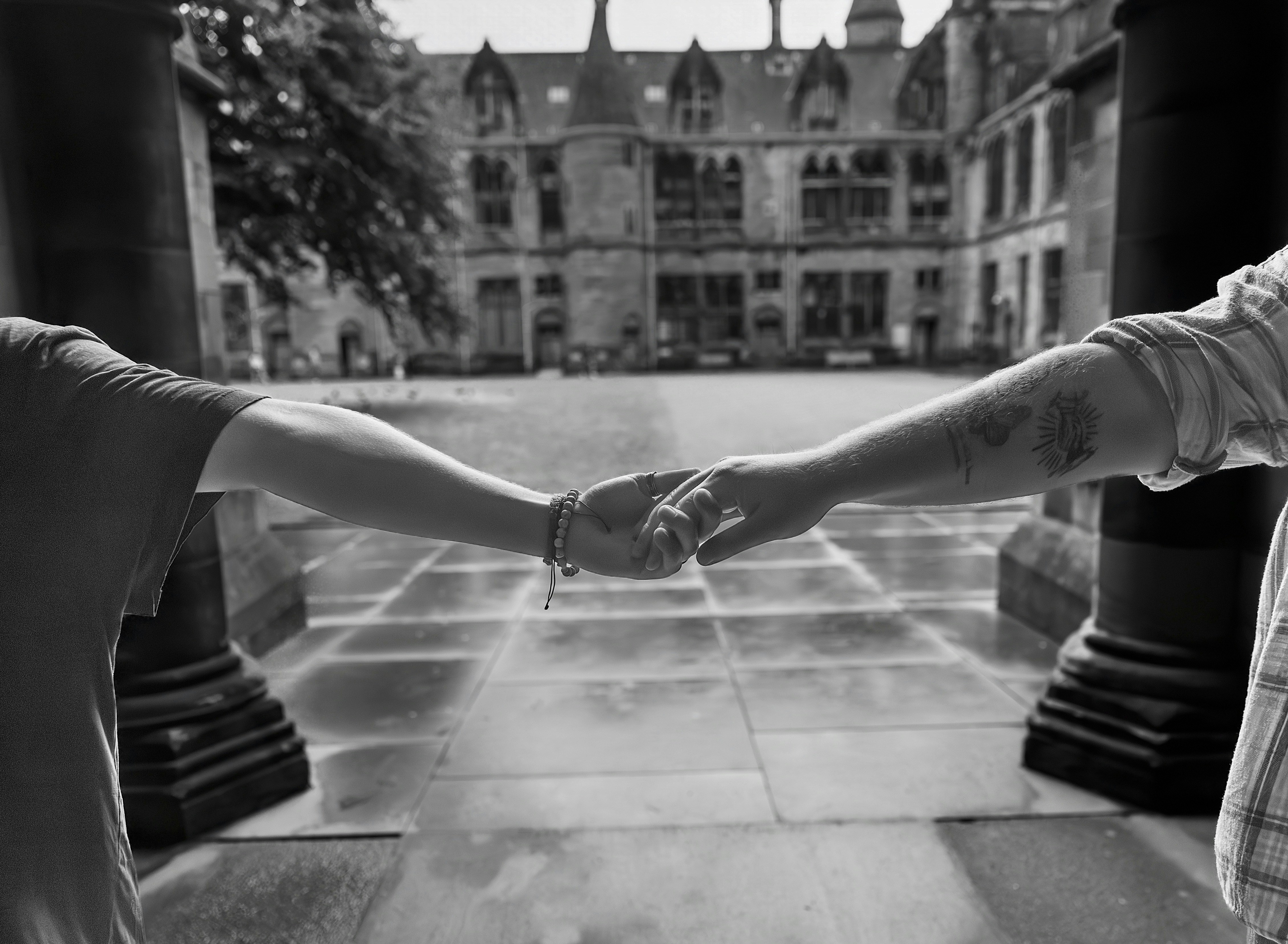 Handshake Across a Historic Courtyard