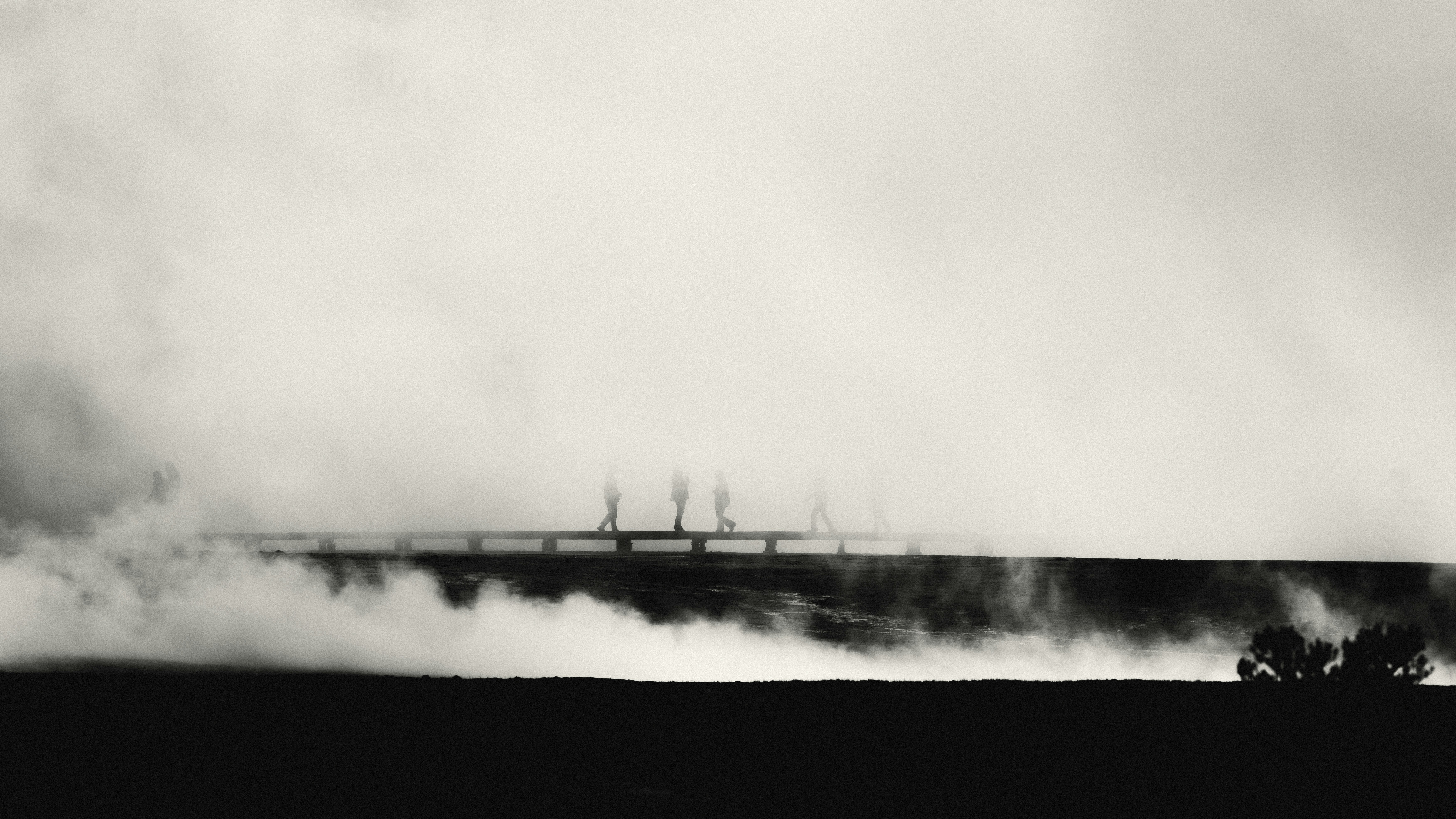 Silhouette Over Fog: A Quiet Bridge Scene