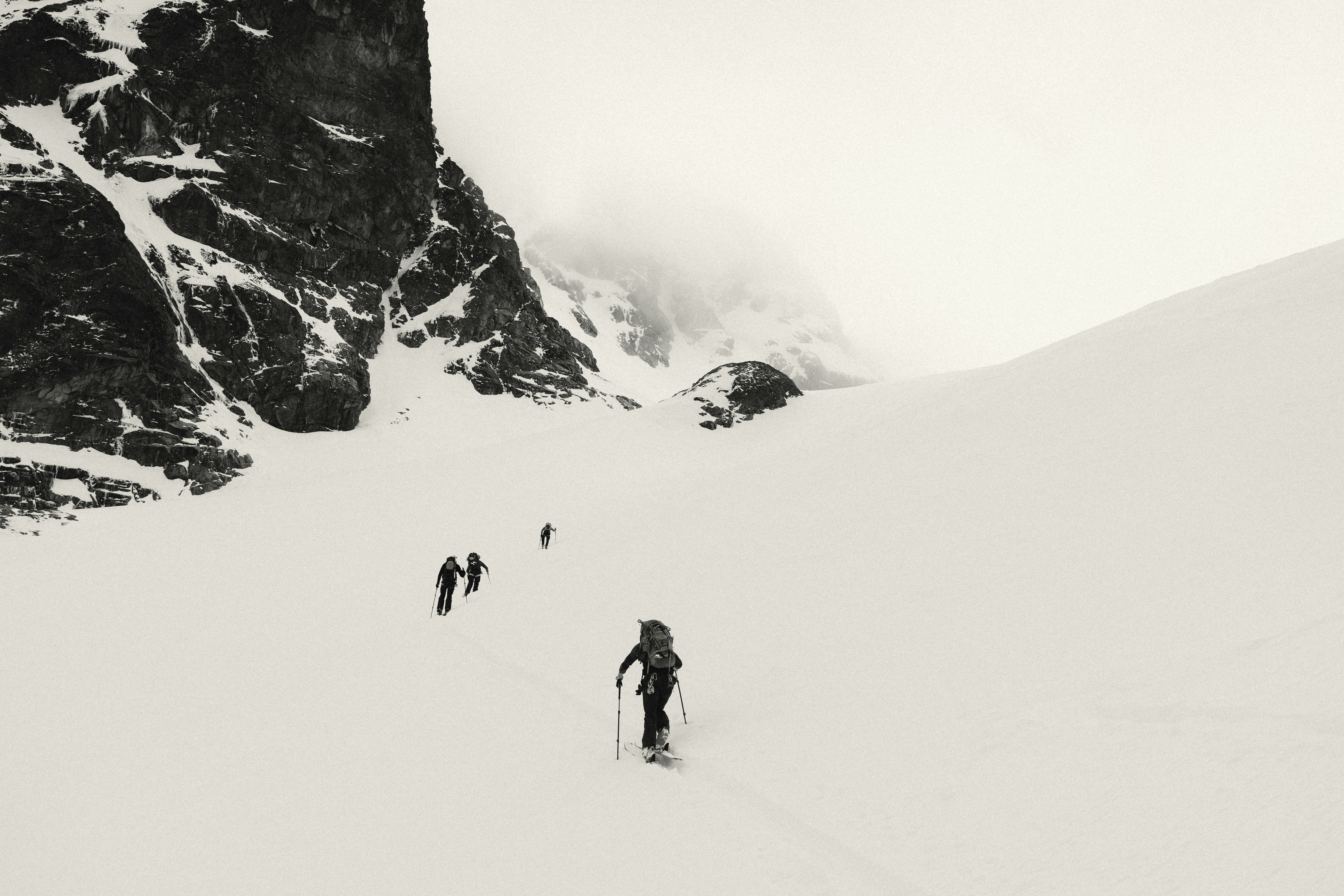 Snowbound Ascent: A Small Group Carves a Silent Path Uphill