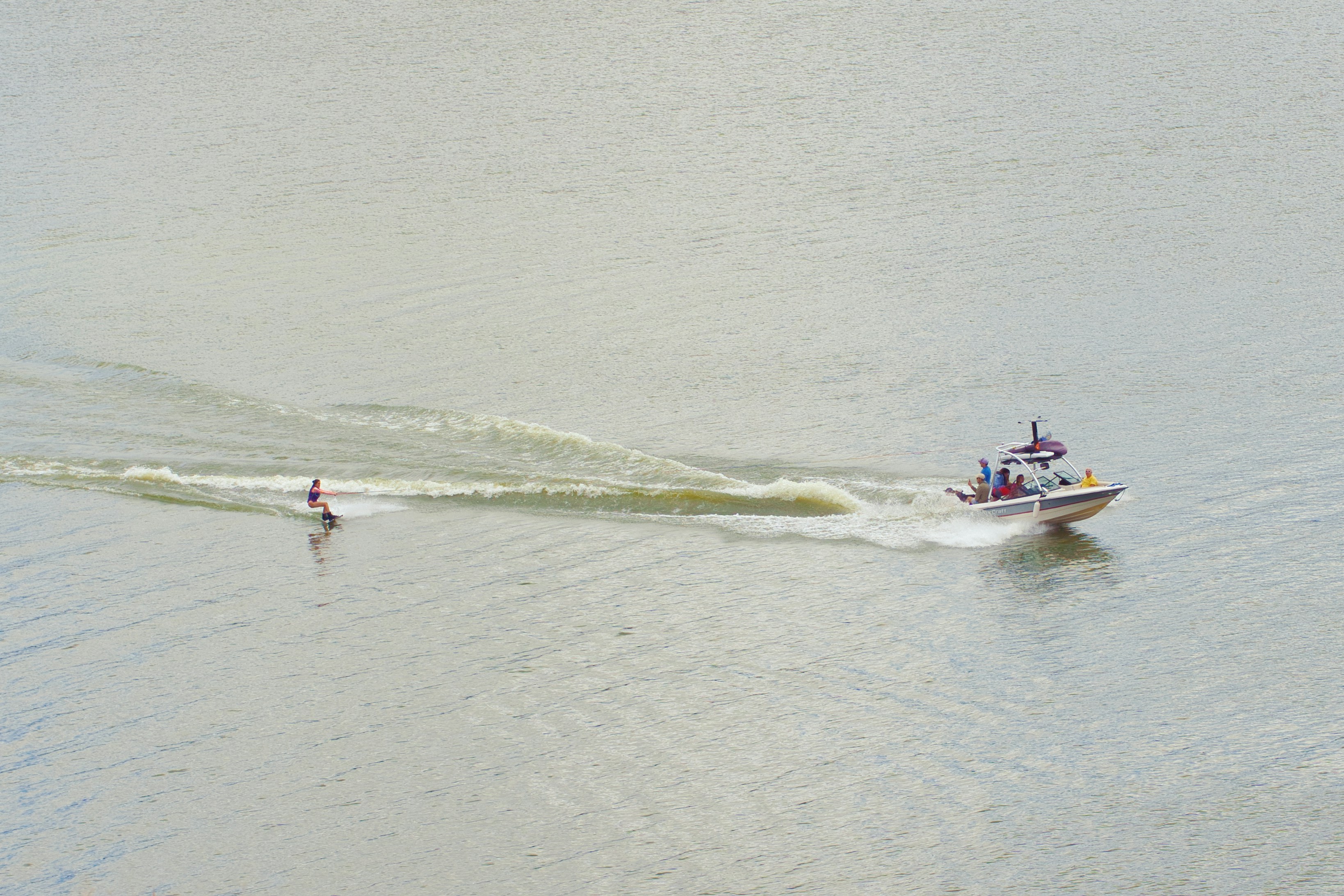 Rope of Water: A Wakeboarder and Rescue Craft Align on Open Water