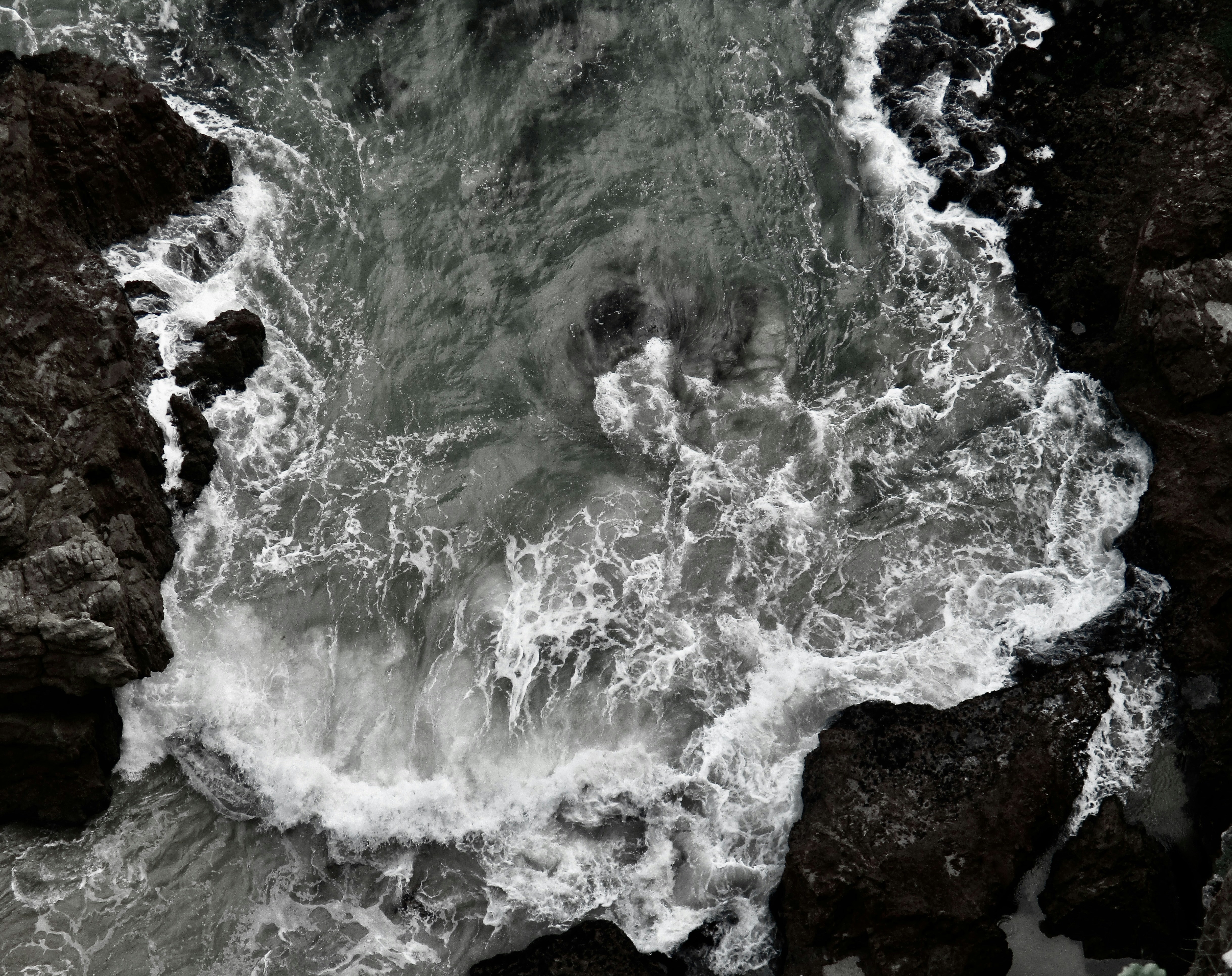 Swirling Sea Whirlpool in Coastal Rock Cavity