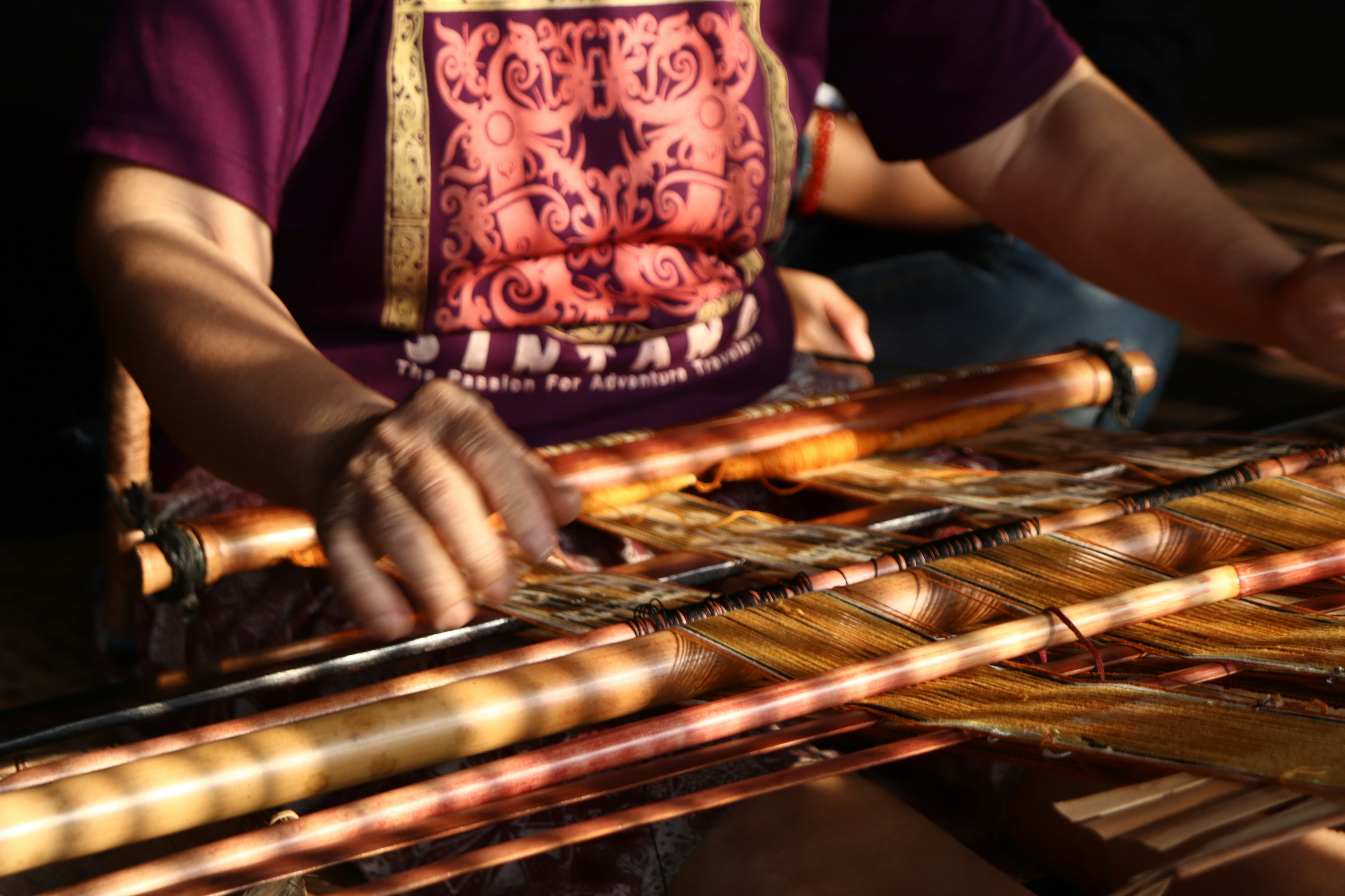 Hands at the Loom: Crafting Color on Traditional Wooden Warp Threads