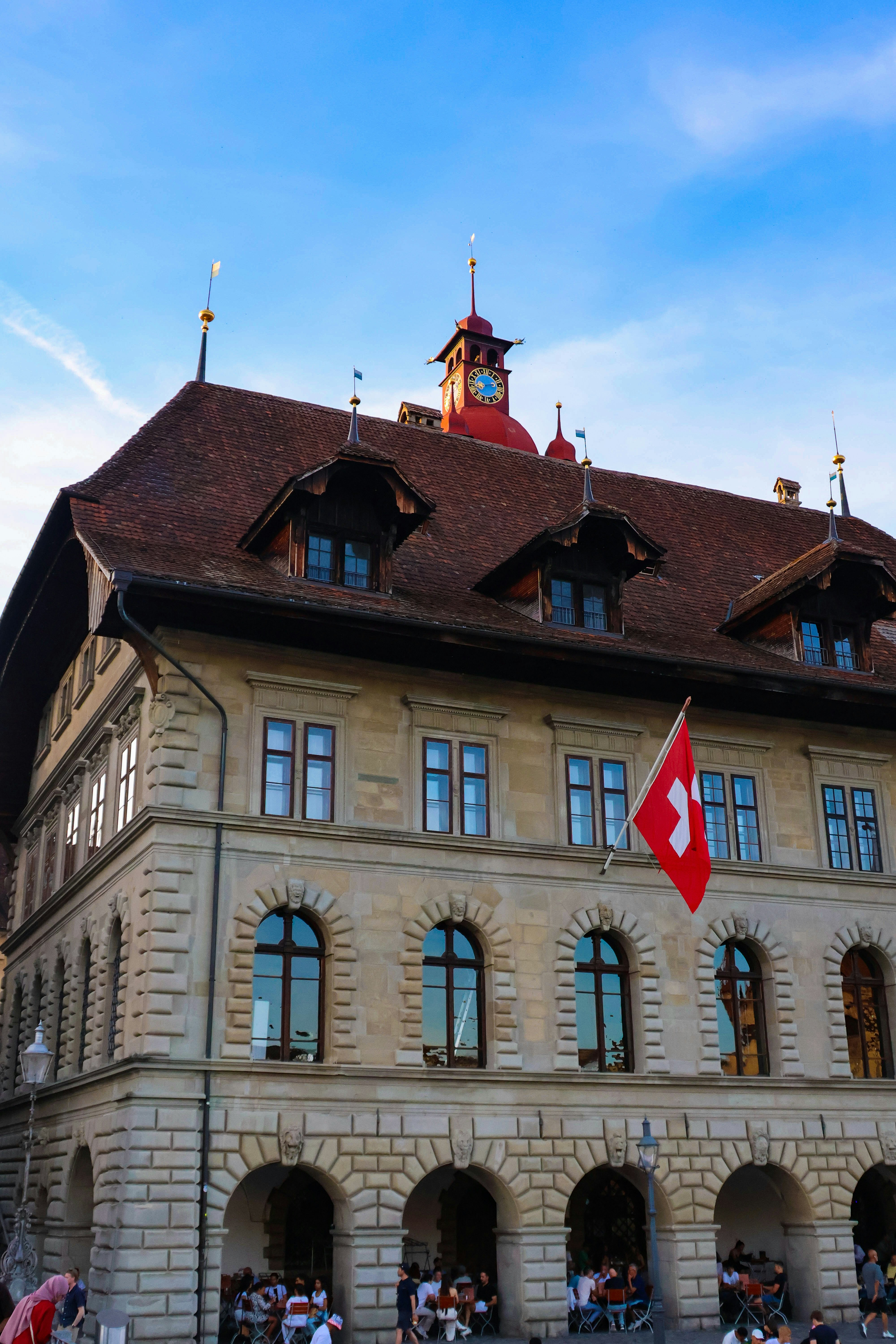 Swiss Flag Over Stately Facades: A Swiss Courtyard in Focus