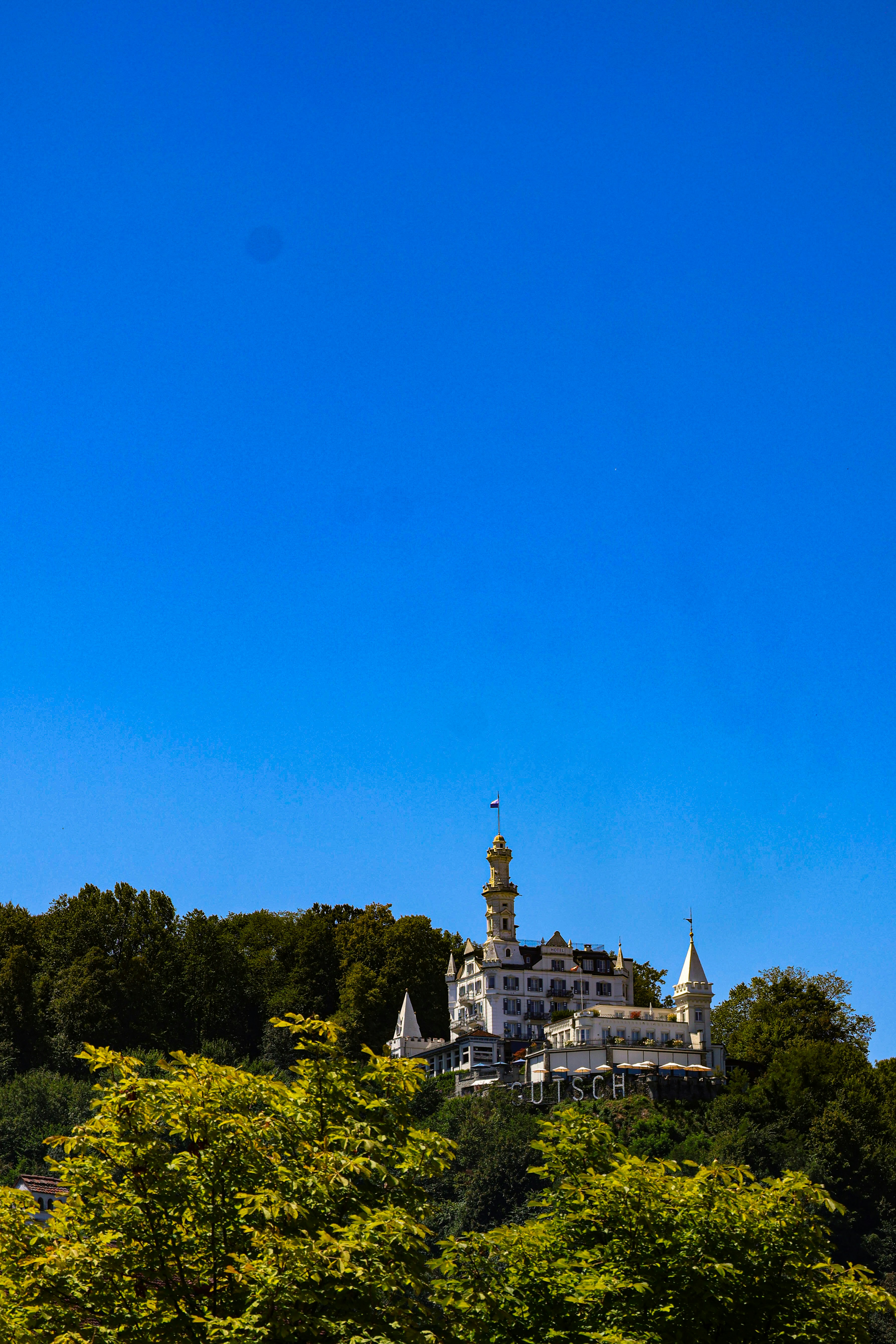 Castle on the Hill: A Clear Blue Sky Over a Historic Terrace