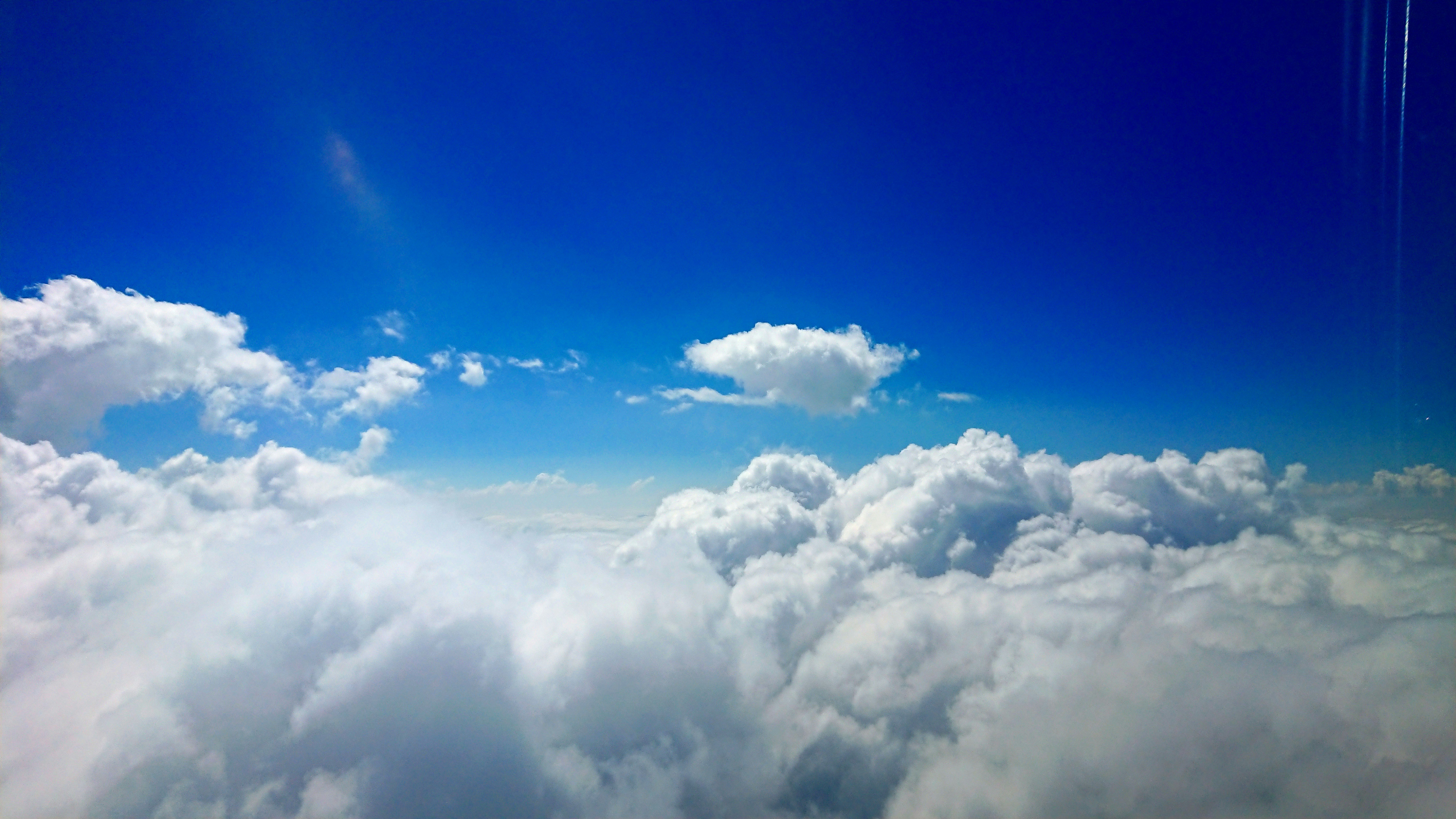 Clearing Above the Clouds: A Quiet Sky Between Blue and White