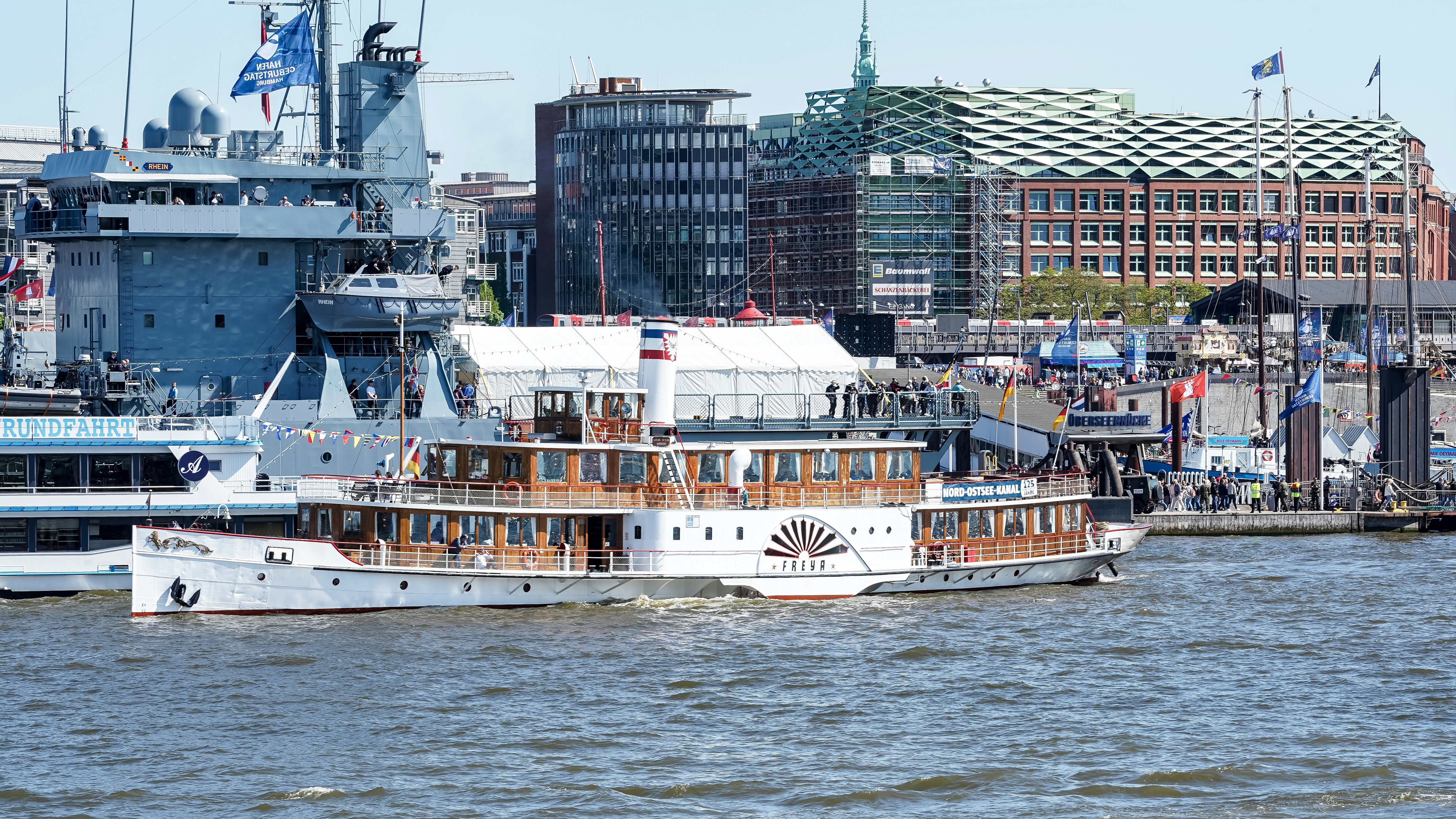 Heritage Stern: The Classic Harbor Passenger Boat in Motion