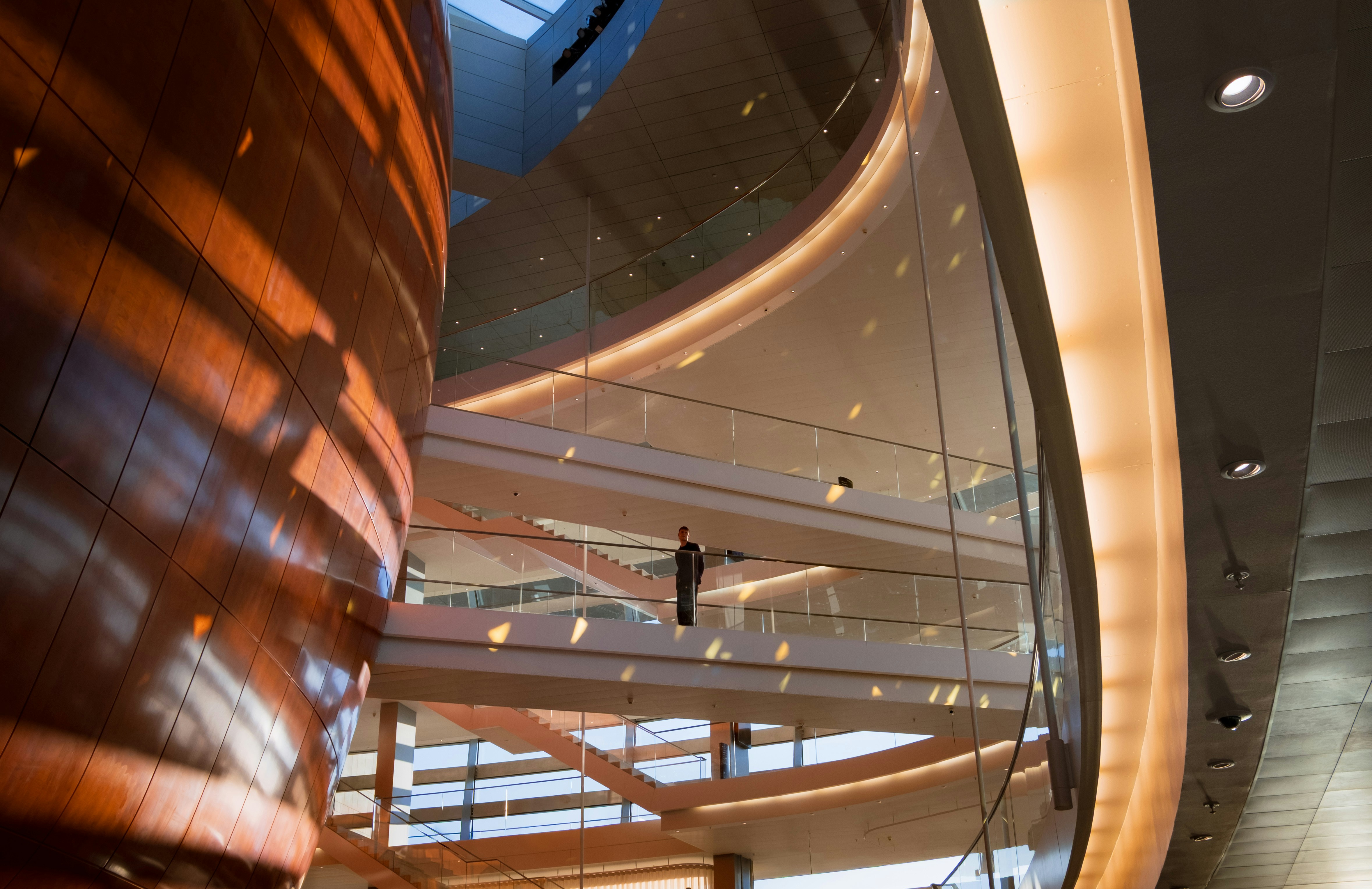 Atrium Curve: Neon Rails and Glass Sky
