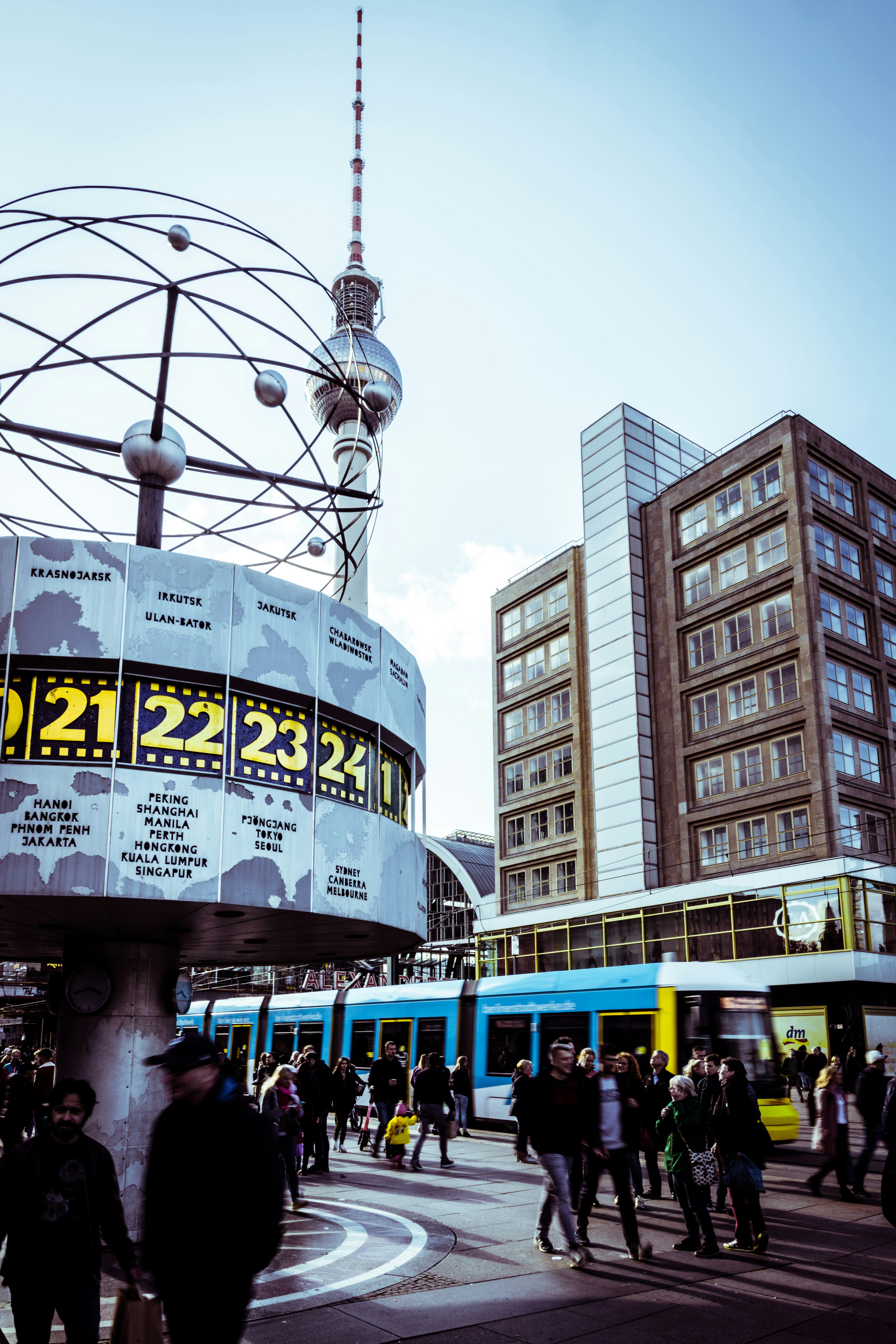 Berlin's World Time Capsule: A Moving Crowd Beneath the Saturn-like Globe