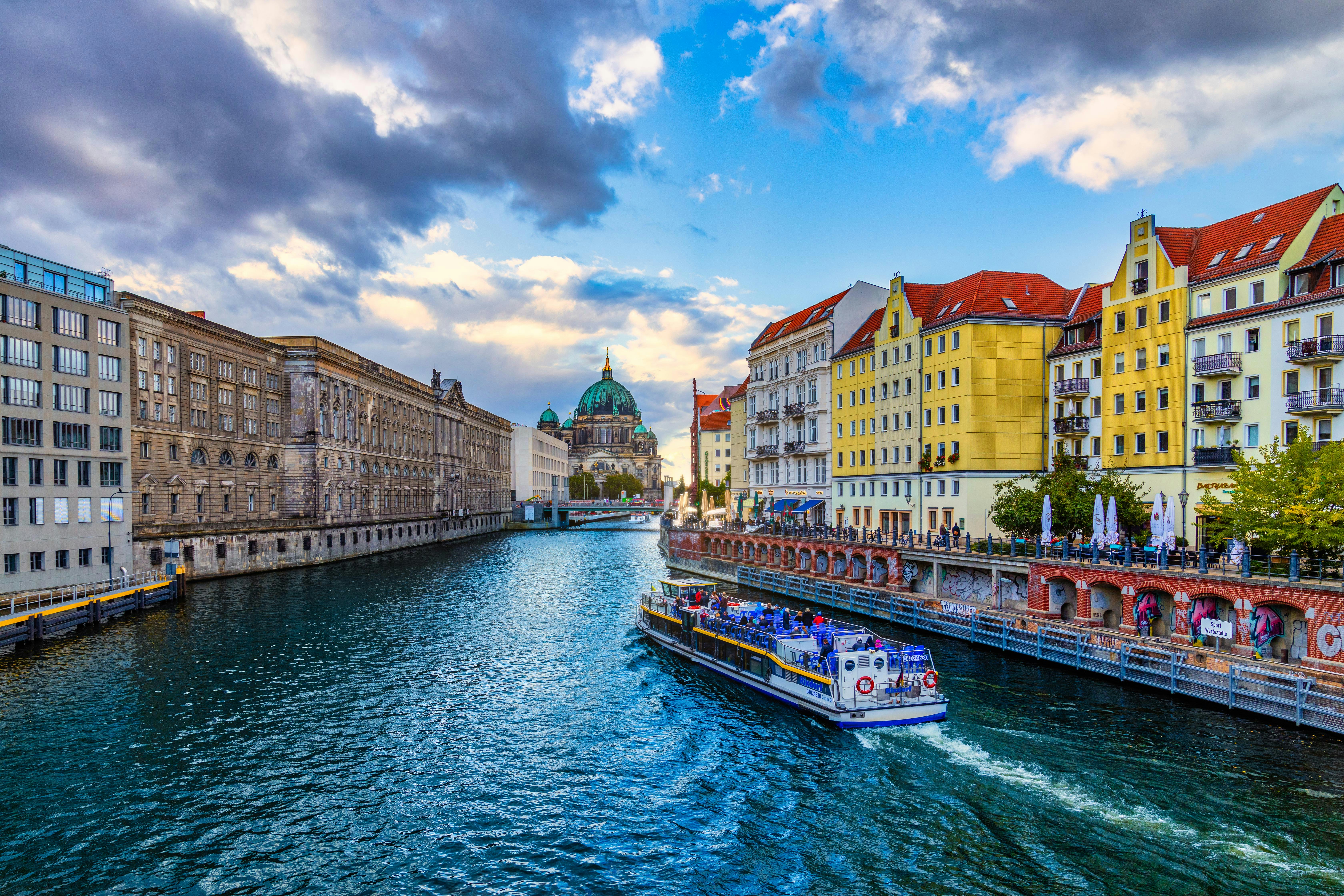 Toward the Dome: A River Parade Under a Sky of Striking Clouds