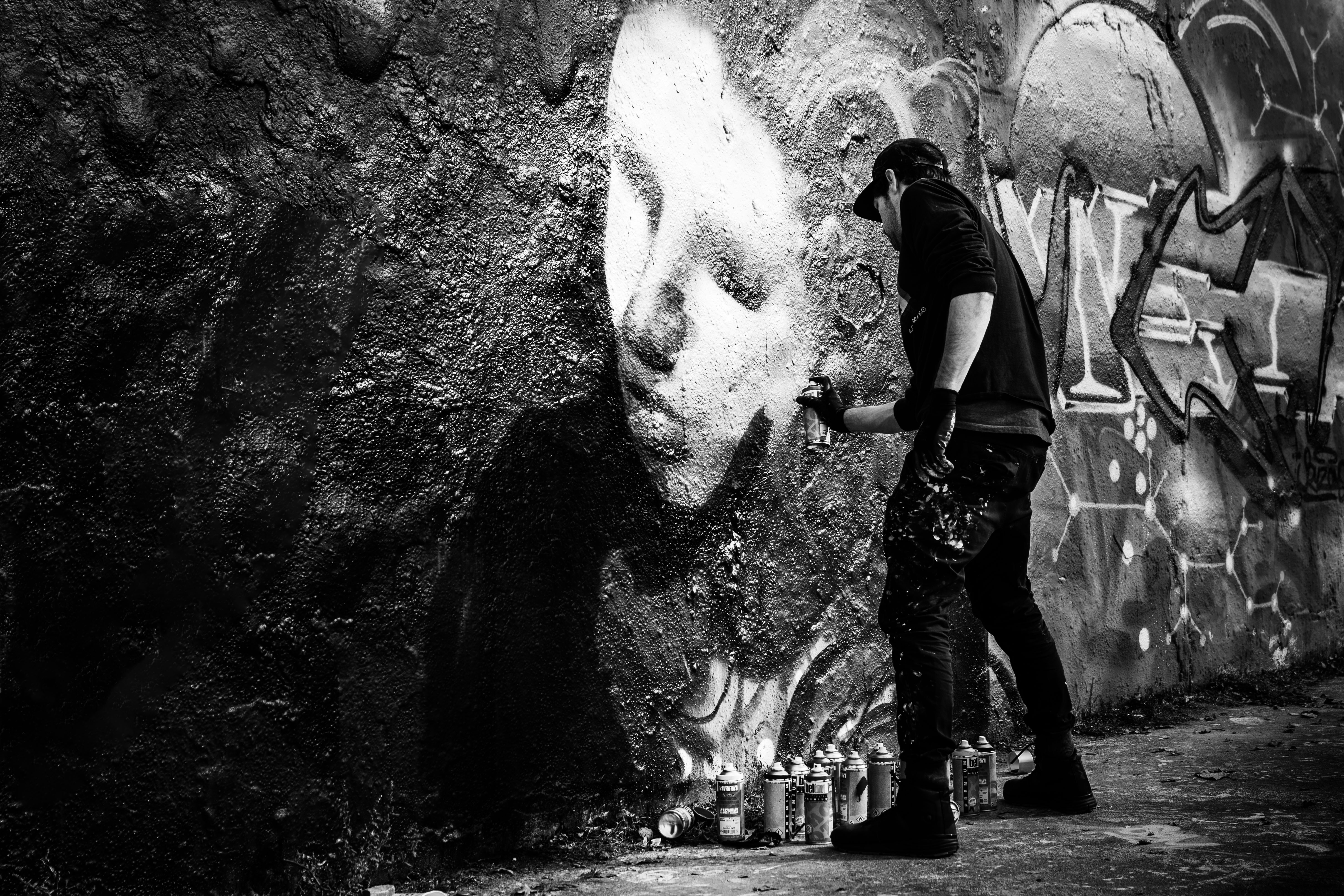 Spray Can Studio: A Shadowed Portrait in Concrete Light