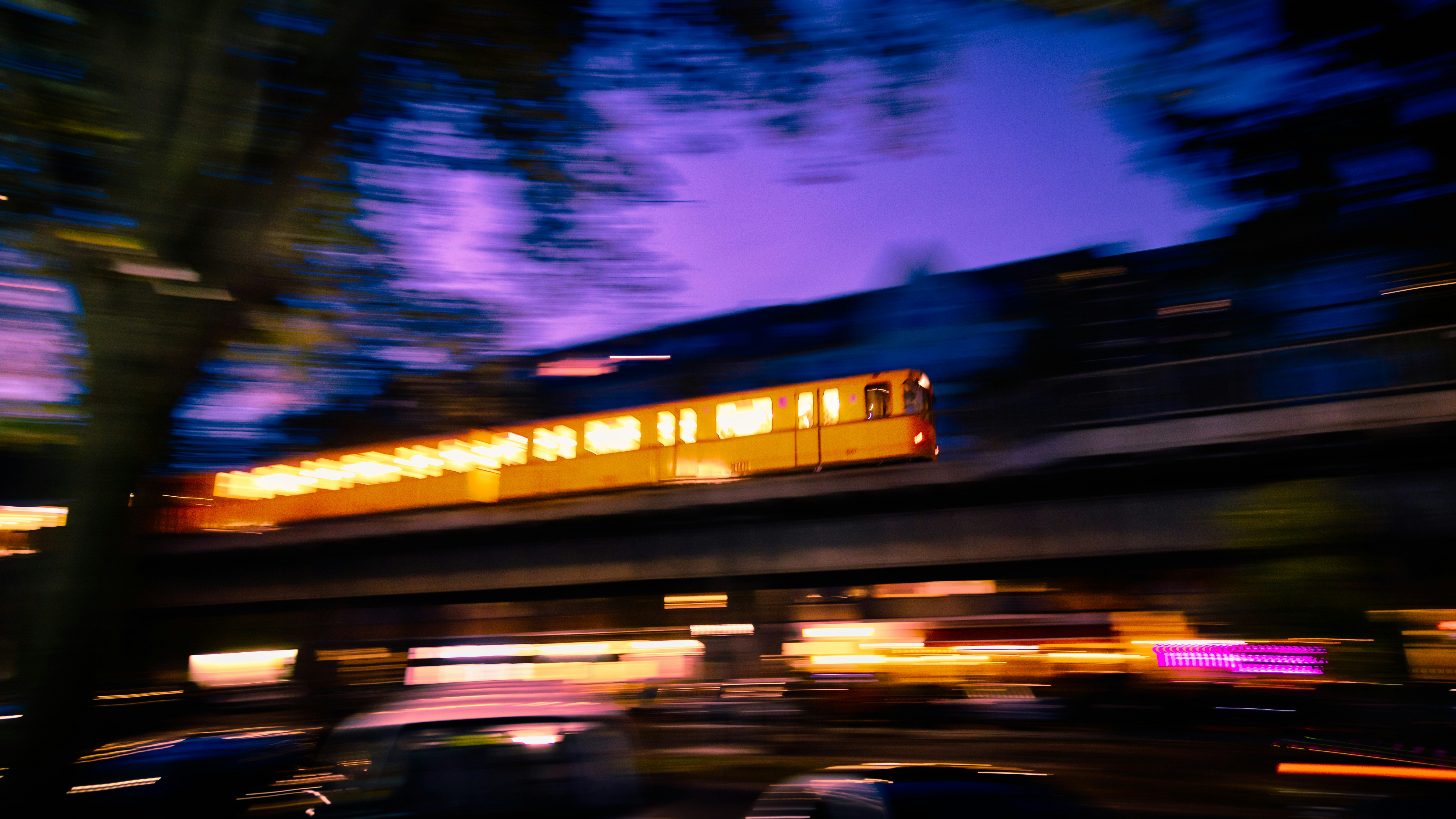 Urban Train in Neon Blur: A Night Ride Through Light and Motion