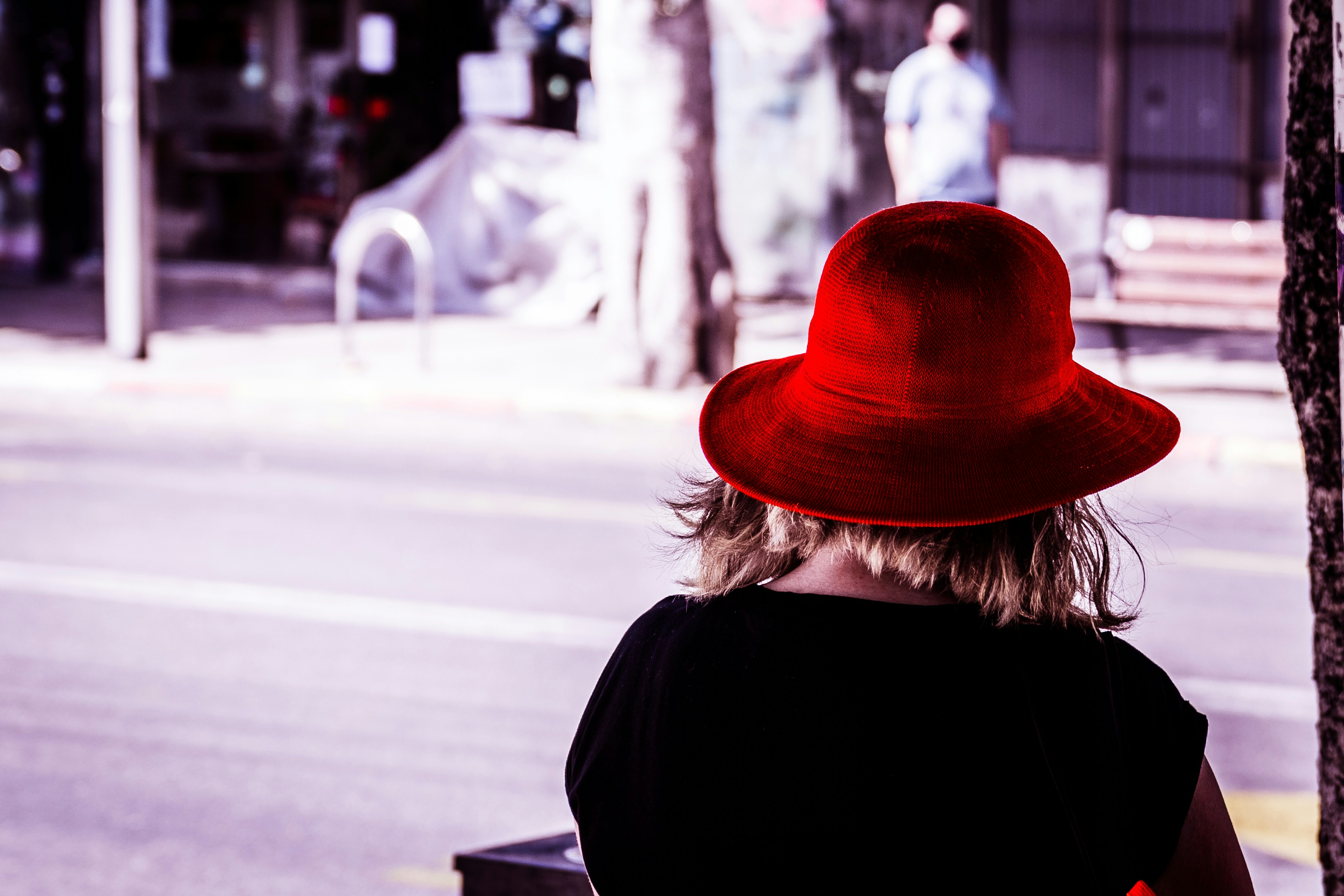 Red-Hatted Subject in a Quiet Street Portrait