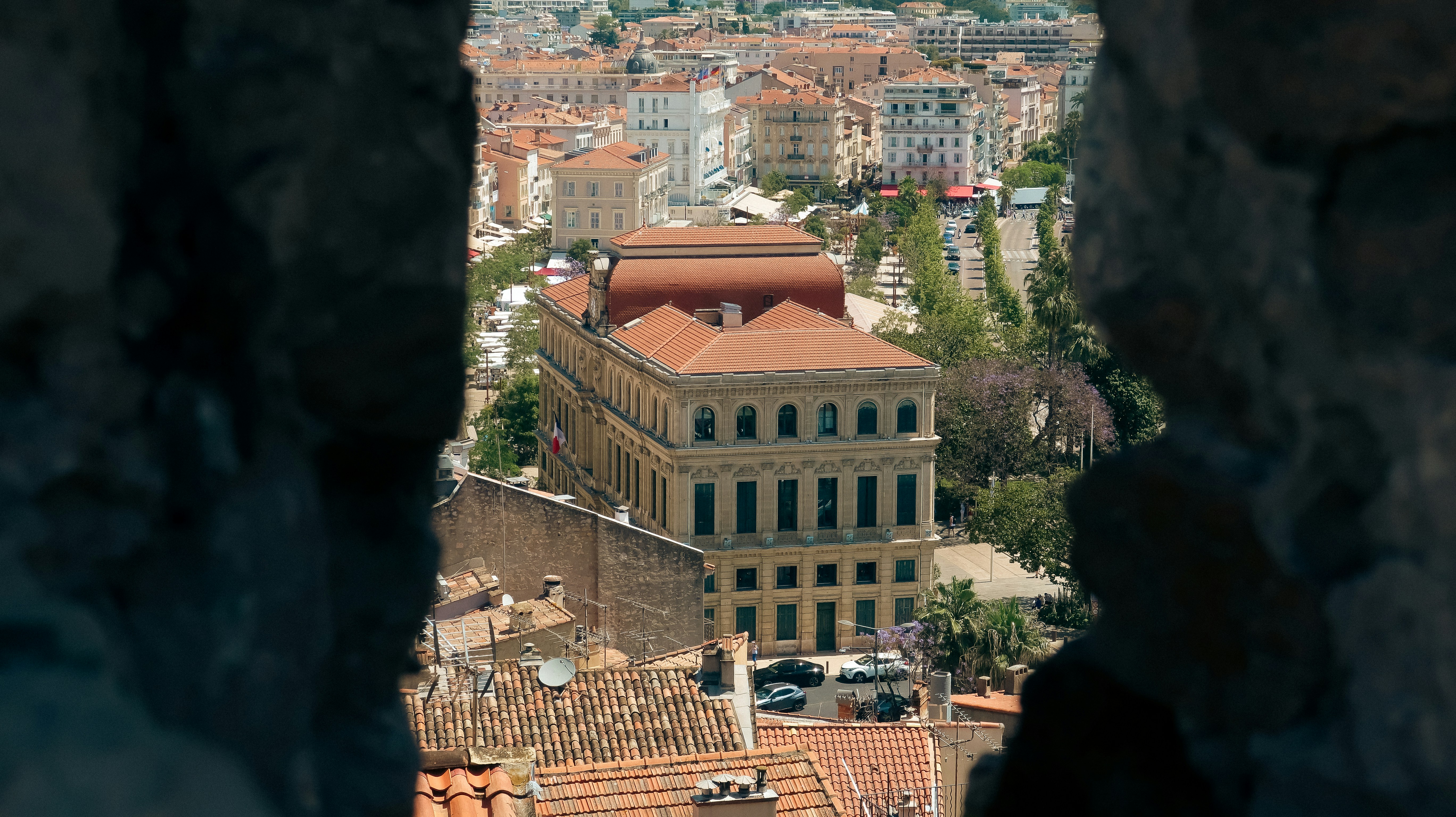 Cityscape Revealed Through a Walled Frame