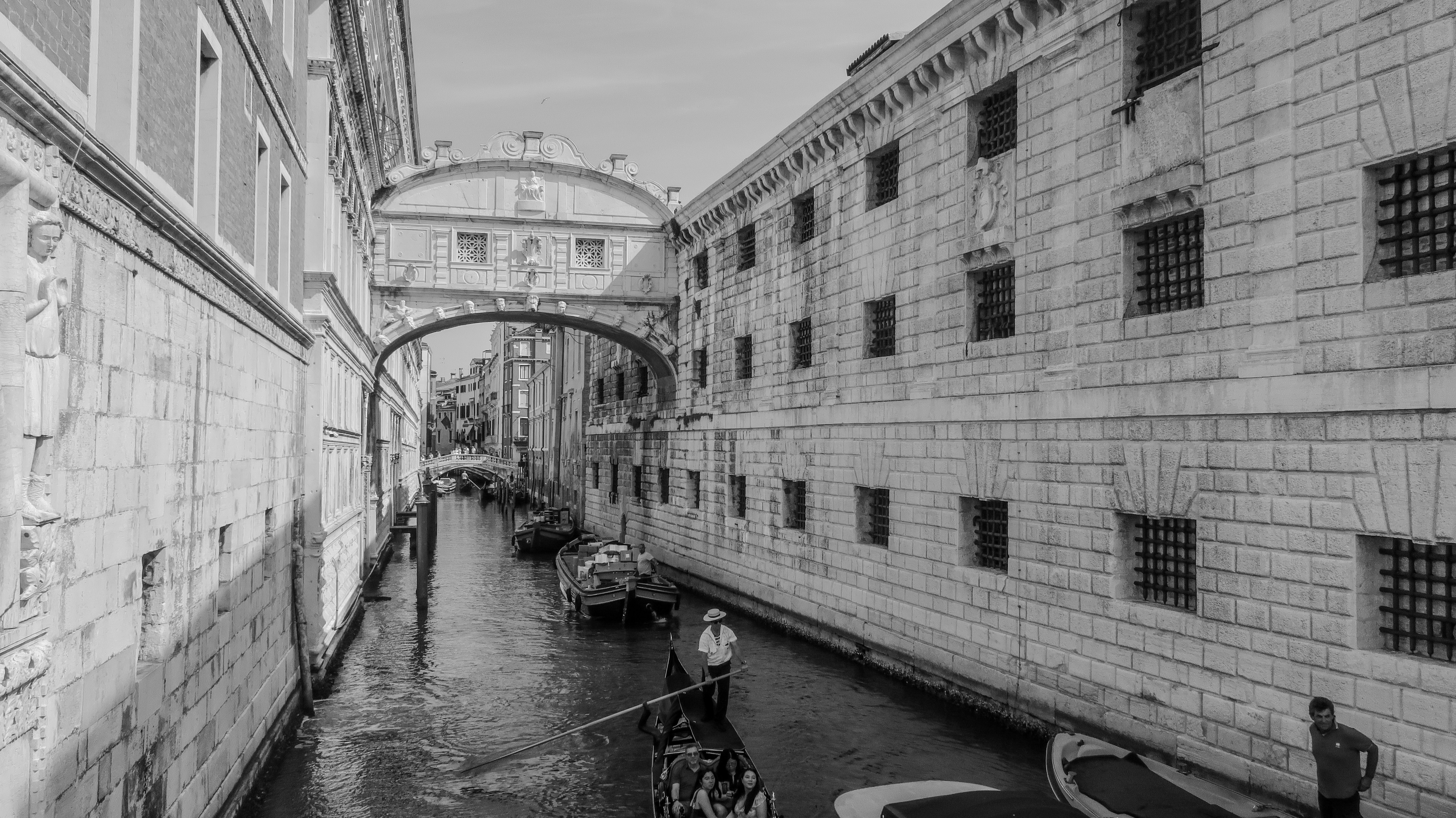 Stone Corridor Over the Canal: A Narrow Venetian Arch Corridor