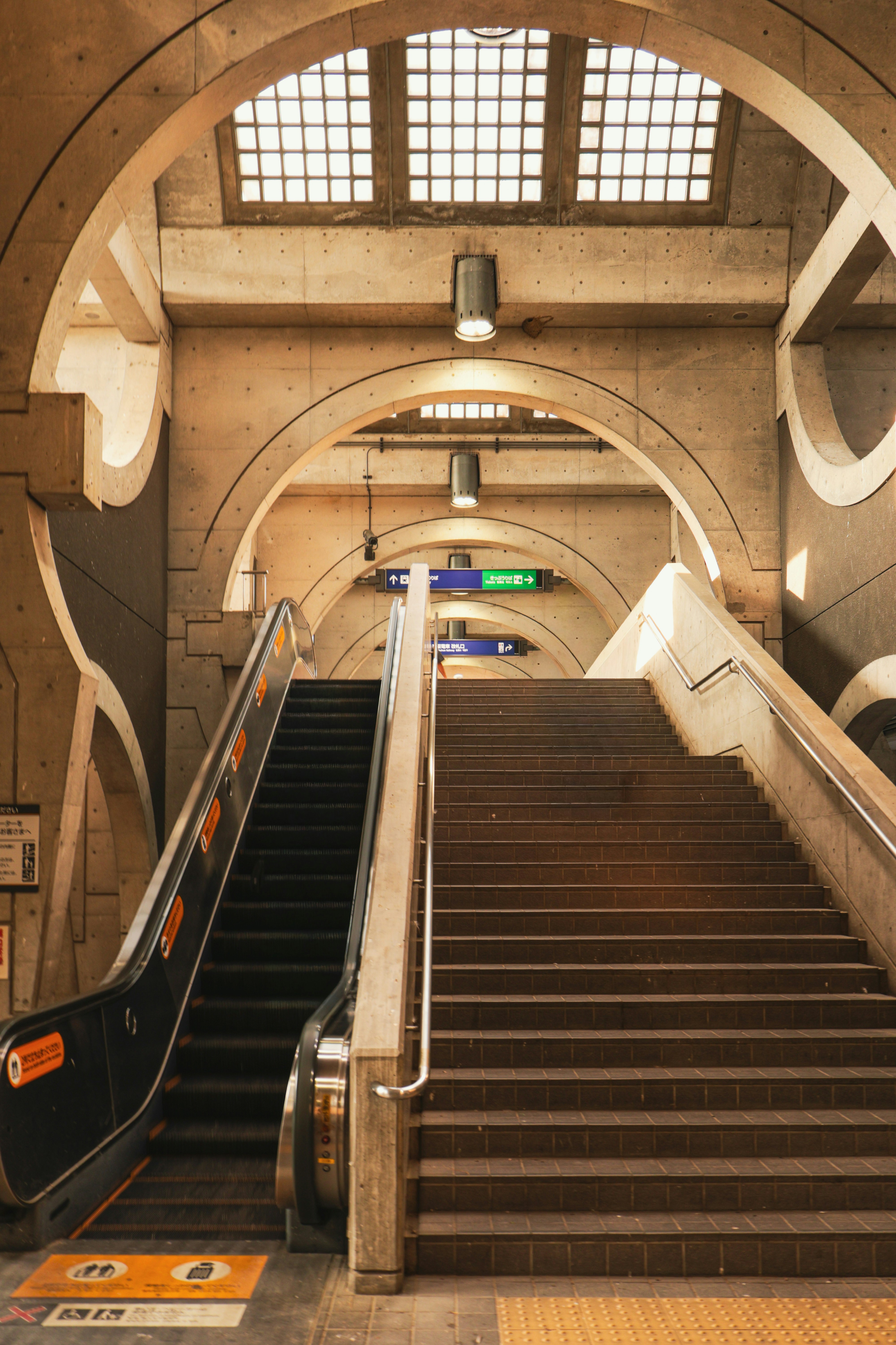 Symmetrical Descent: Concrete Arches and Dual Escalators