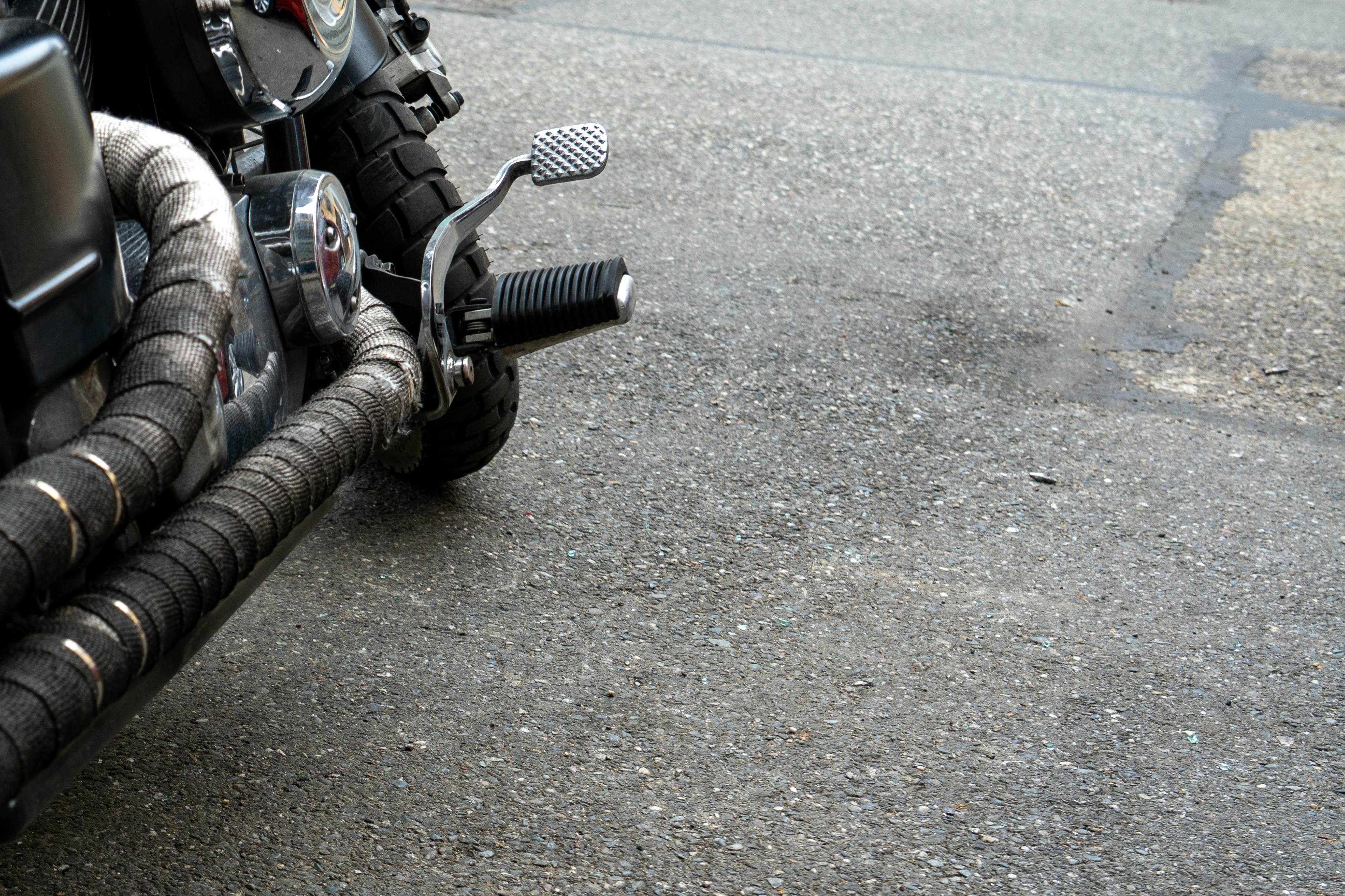 Chrome-Tipped Exhaust and Tethered Tire on Street Machine