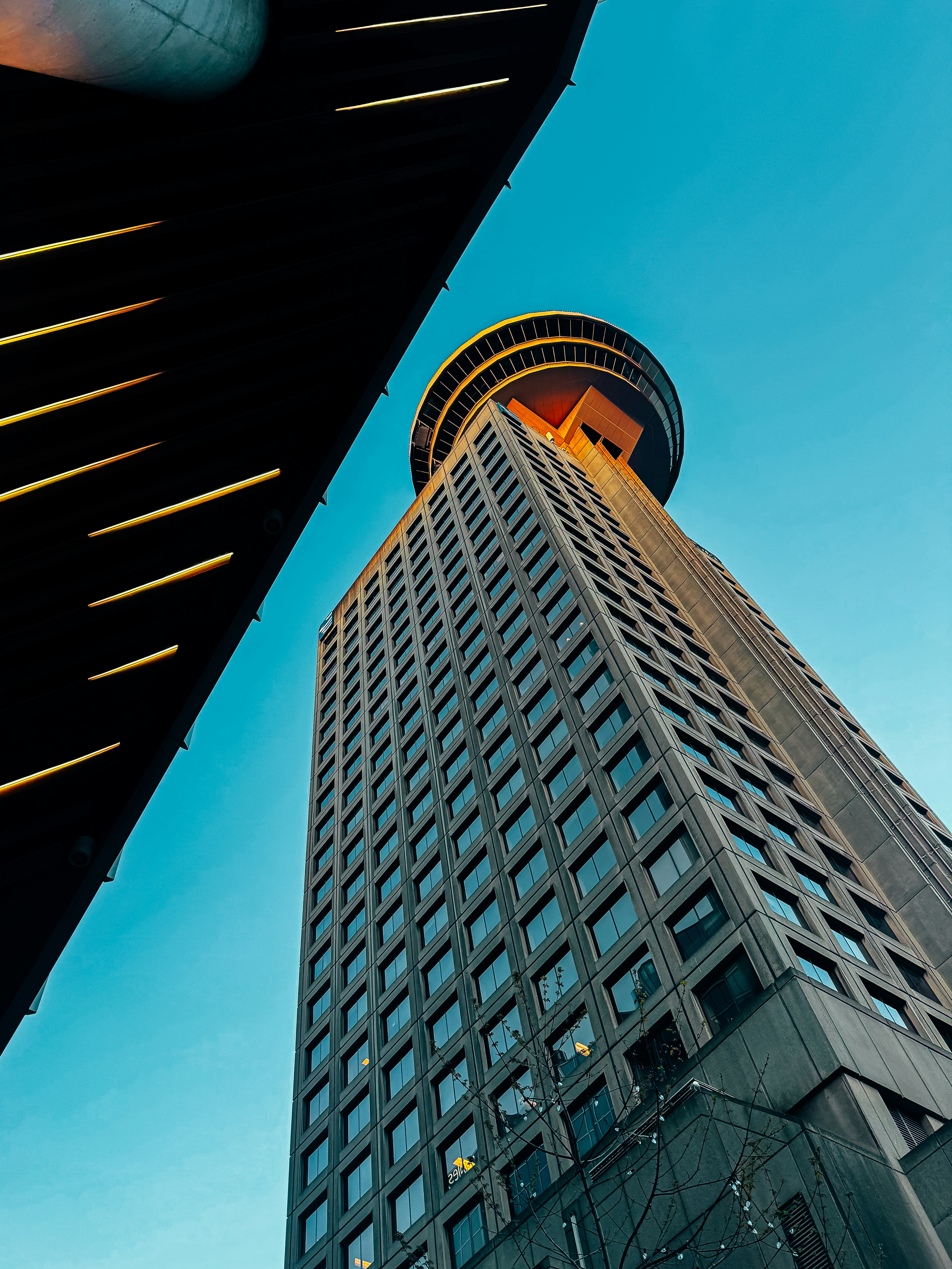Endless Spire: A Tower Reaches Toward a Clear Blue Sky