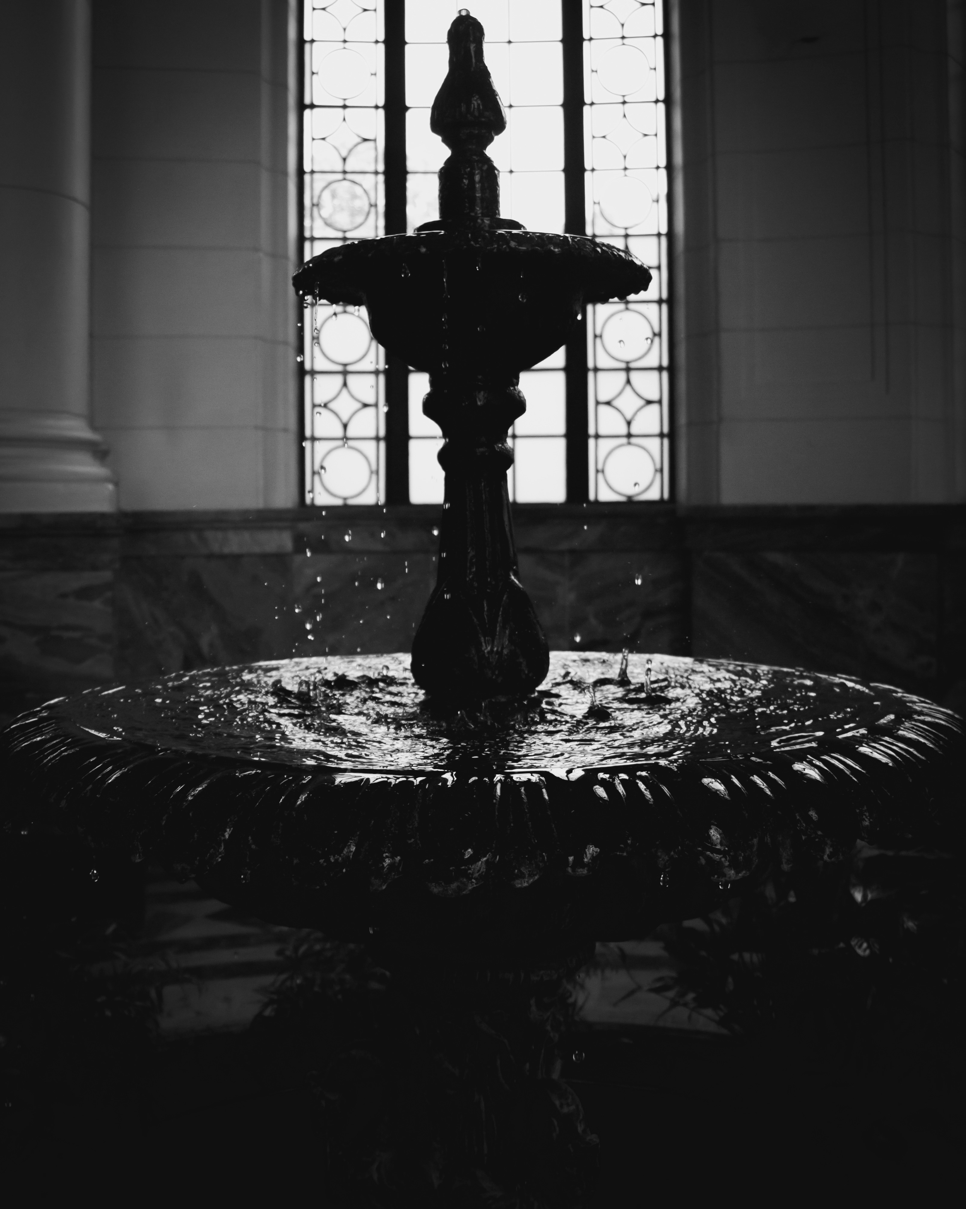 Midnight Fountain: A SilentSilhouette in the Monochrome Atrium