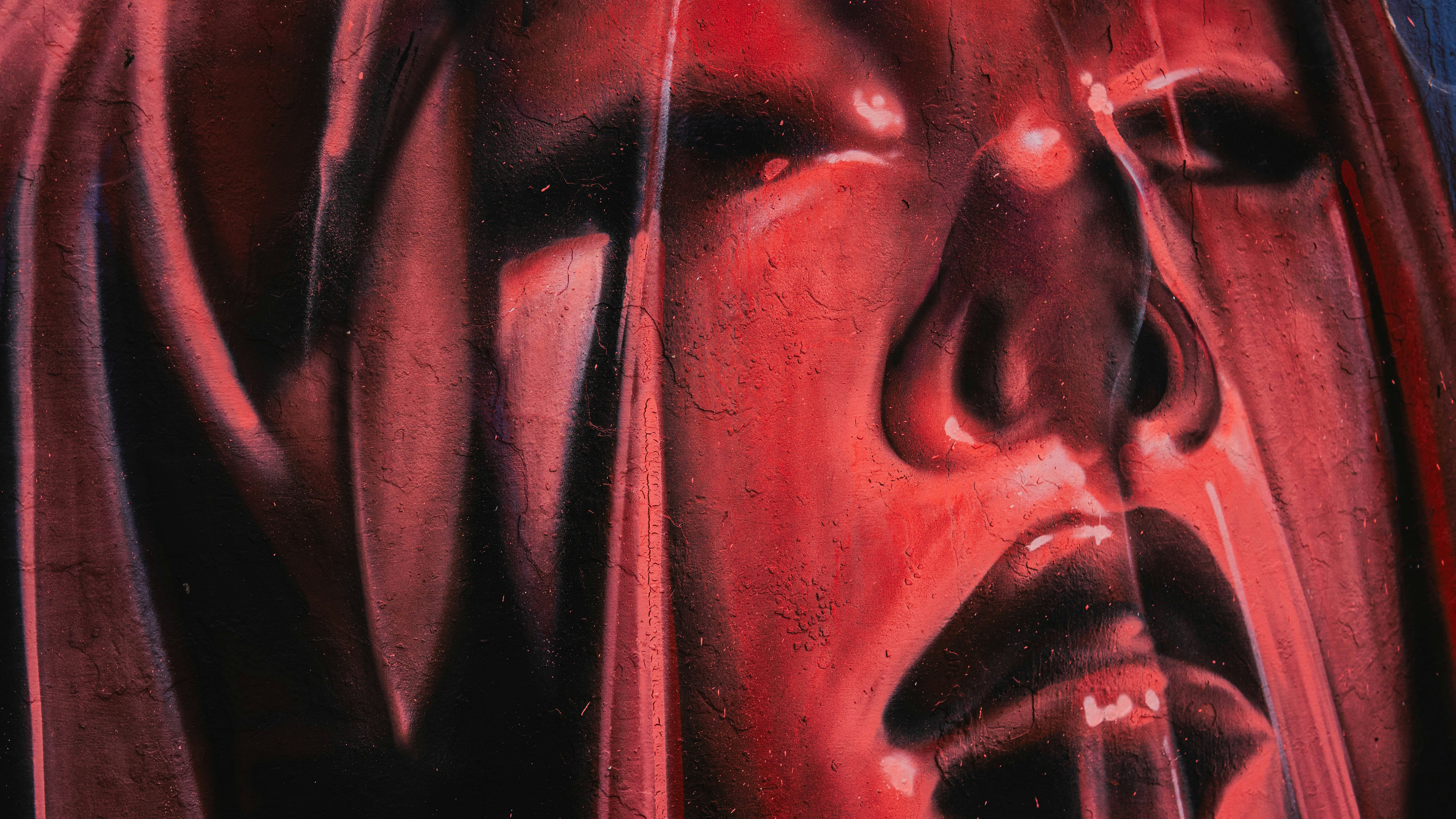 Veiled Red Portrait: A Glimpse Through Glass and Rain