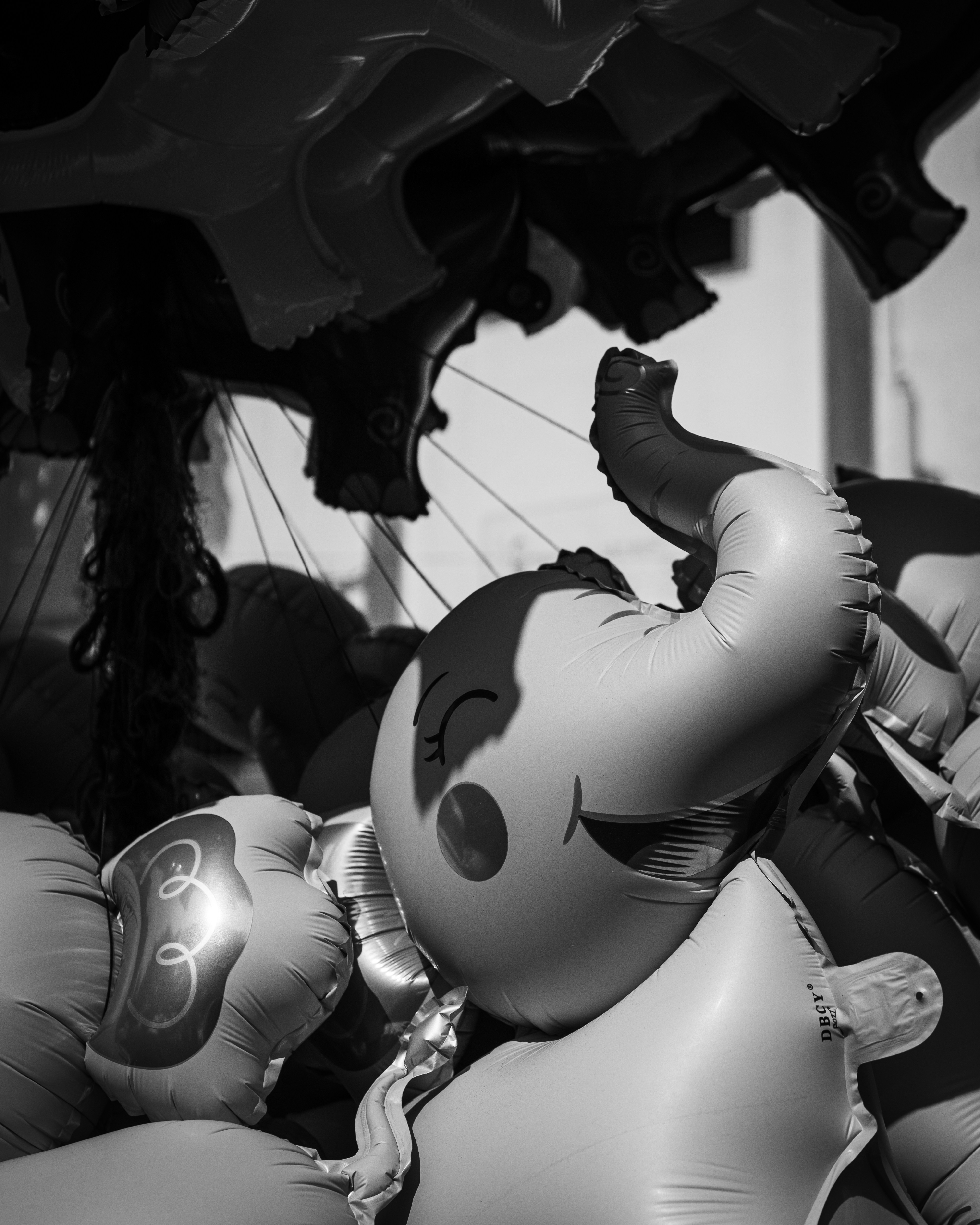 Inflatable Elephant Parade: Subtle Grins in a Monochrome Circus