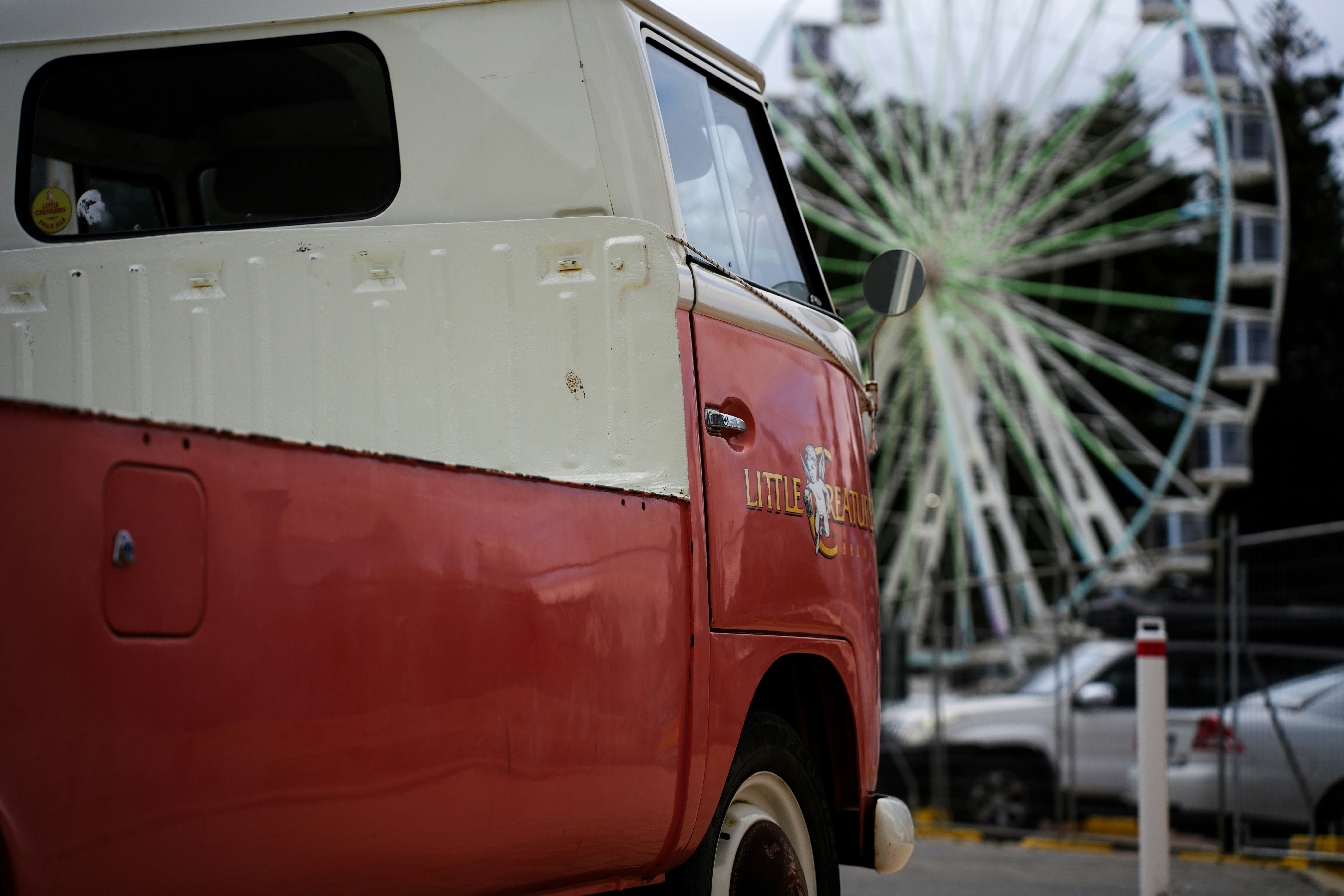 Red Vintage Van with Ferris Wheel Backdrop