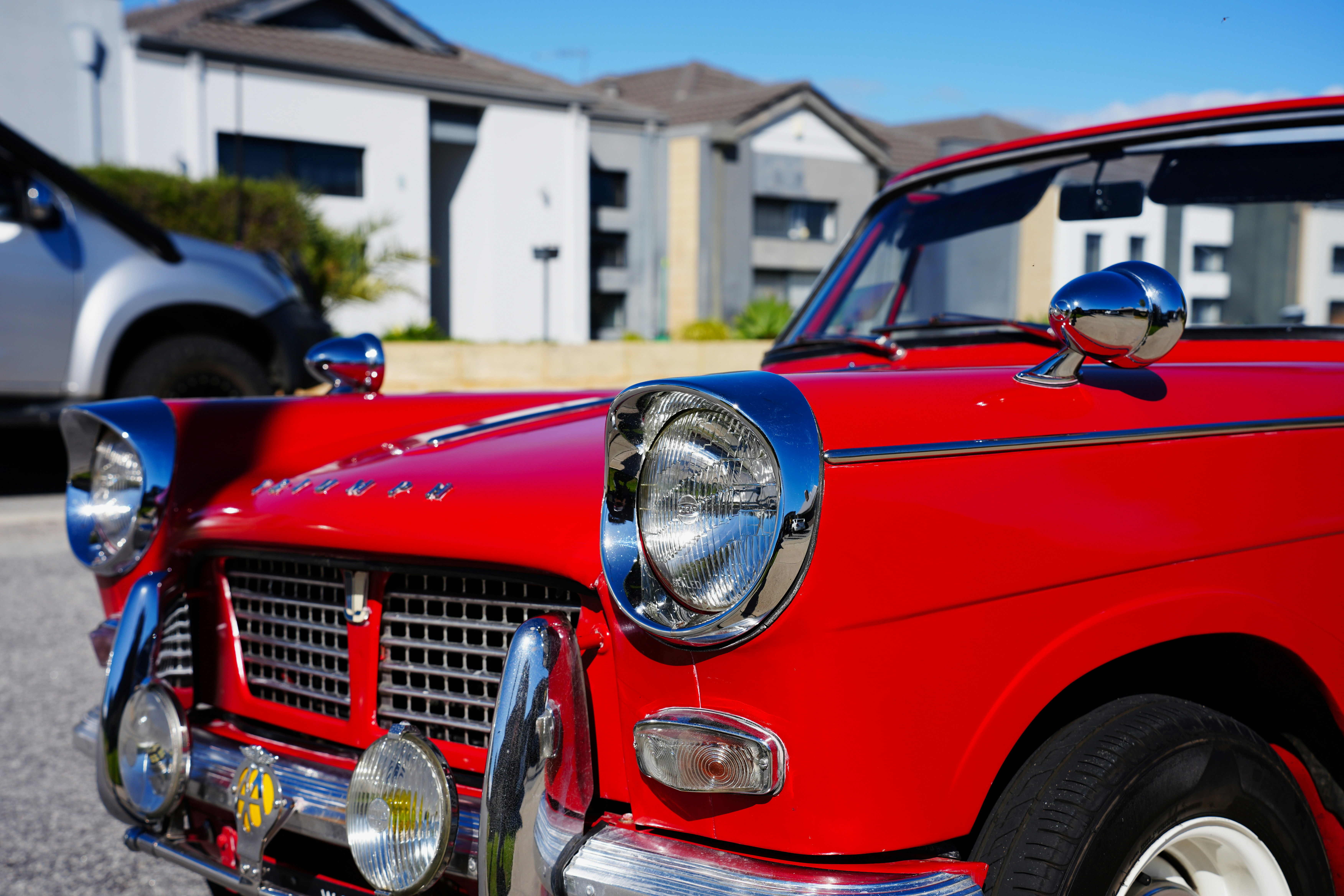 Crimson Classic: A Front-Quarter Portrait of a Vintage Red Car