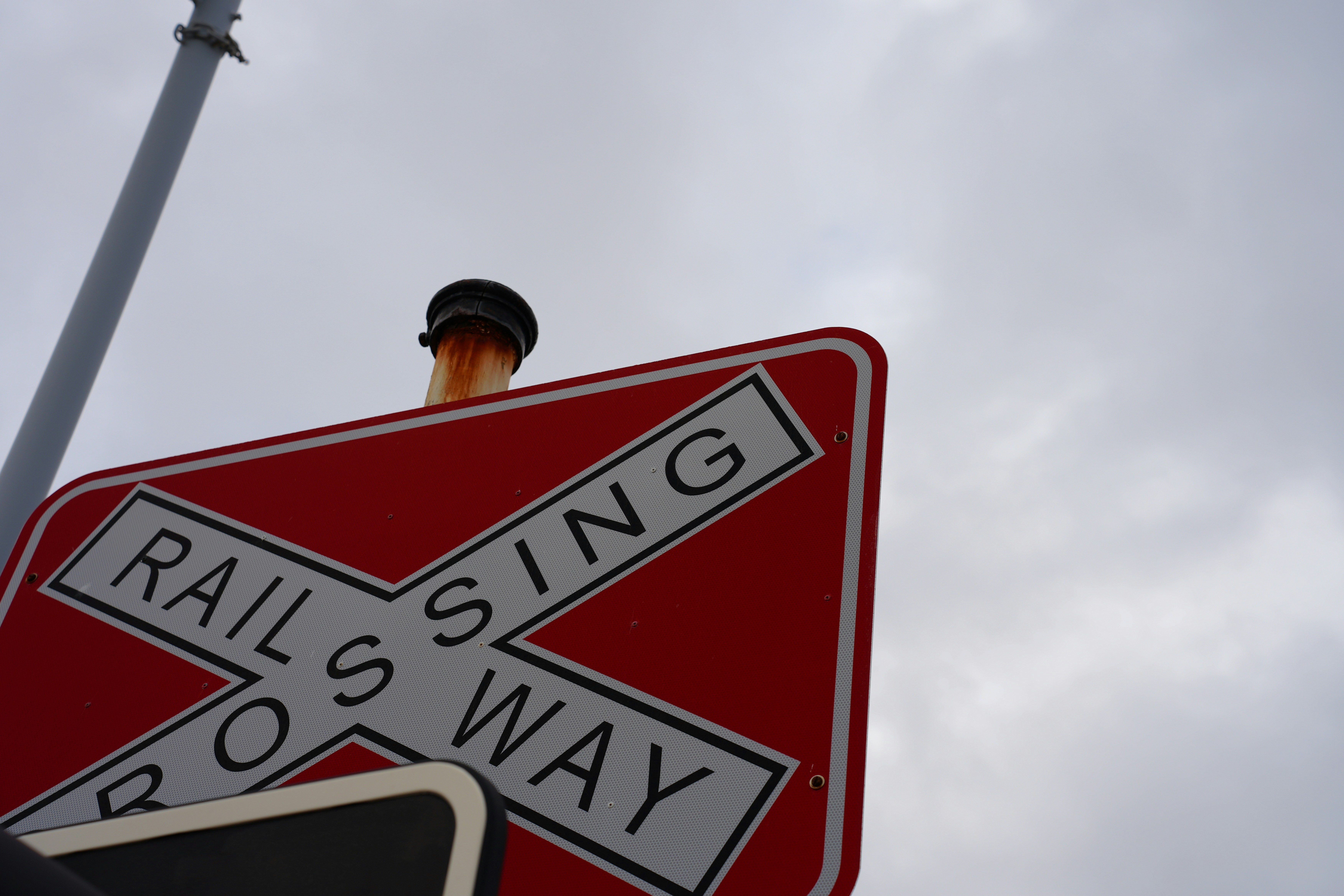 Railroad Crossing Sign Reaches for the Sky