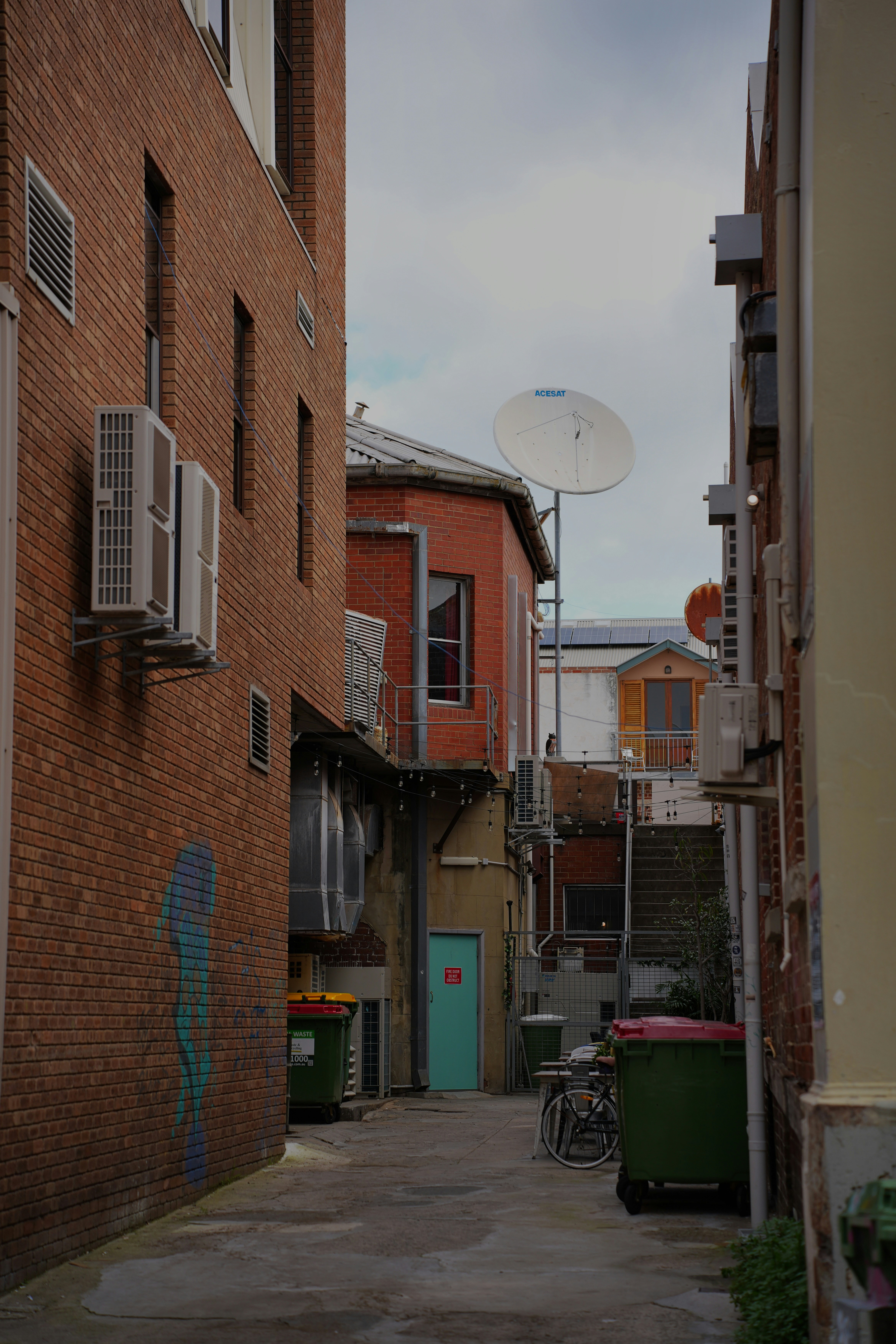 Urban Back Alley: A Quiet Corridor Between Brick Facades