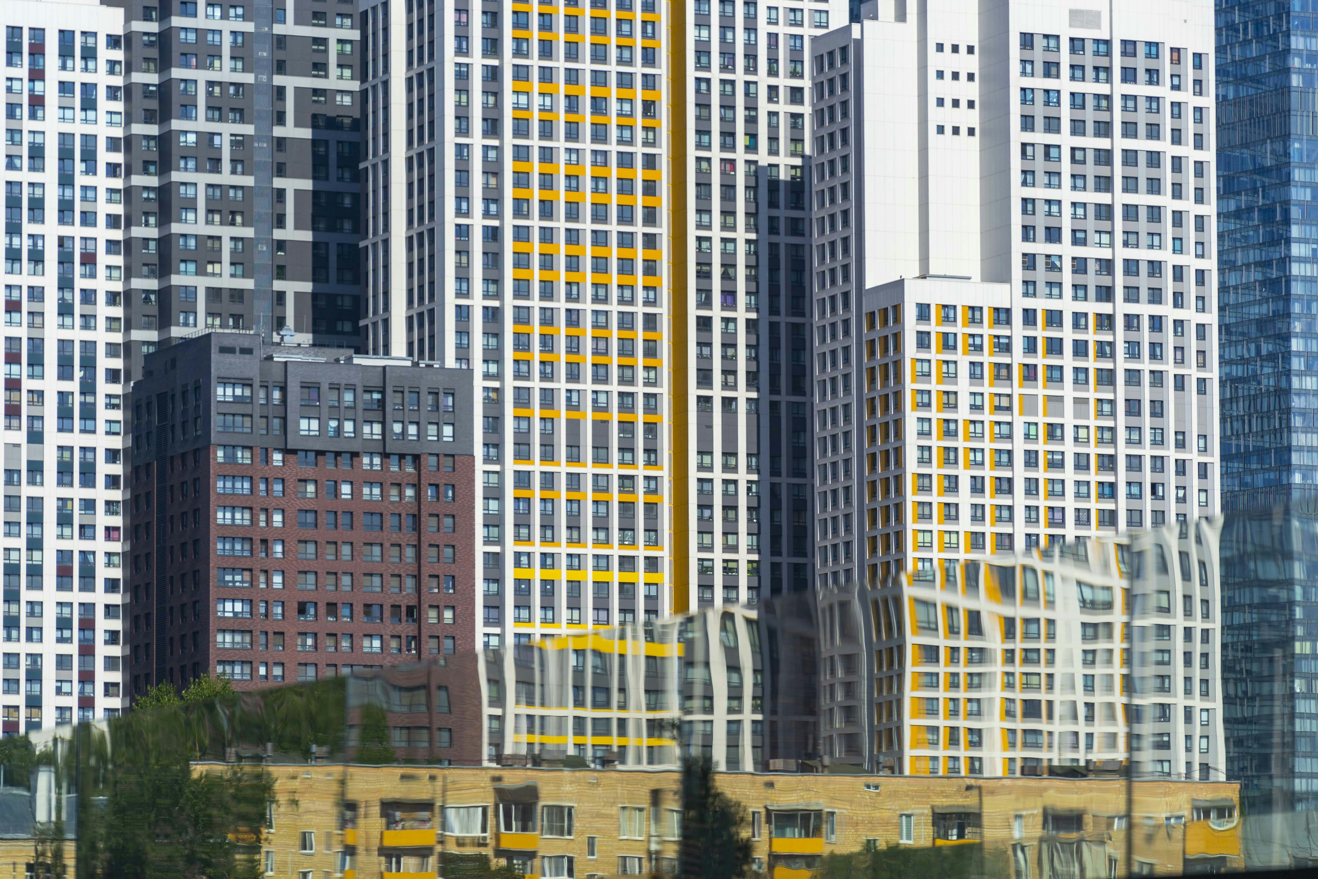 Urban Facade: Glass and Brick Rise Above the Street