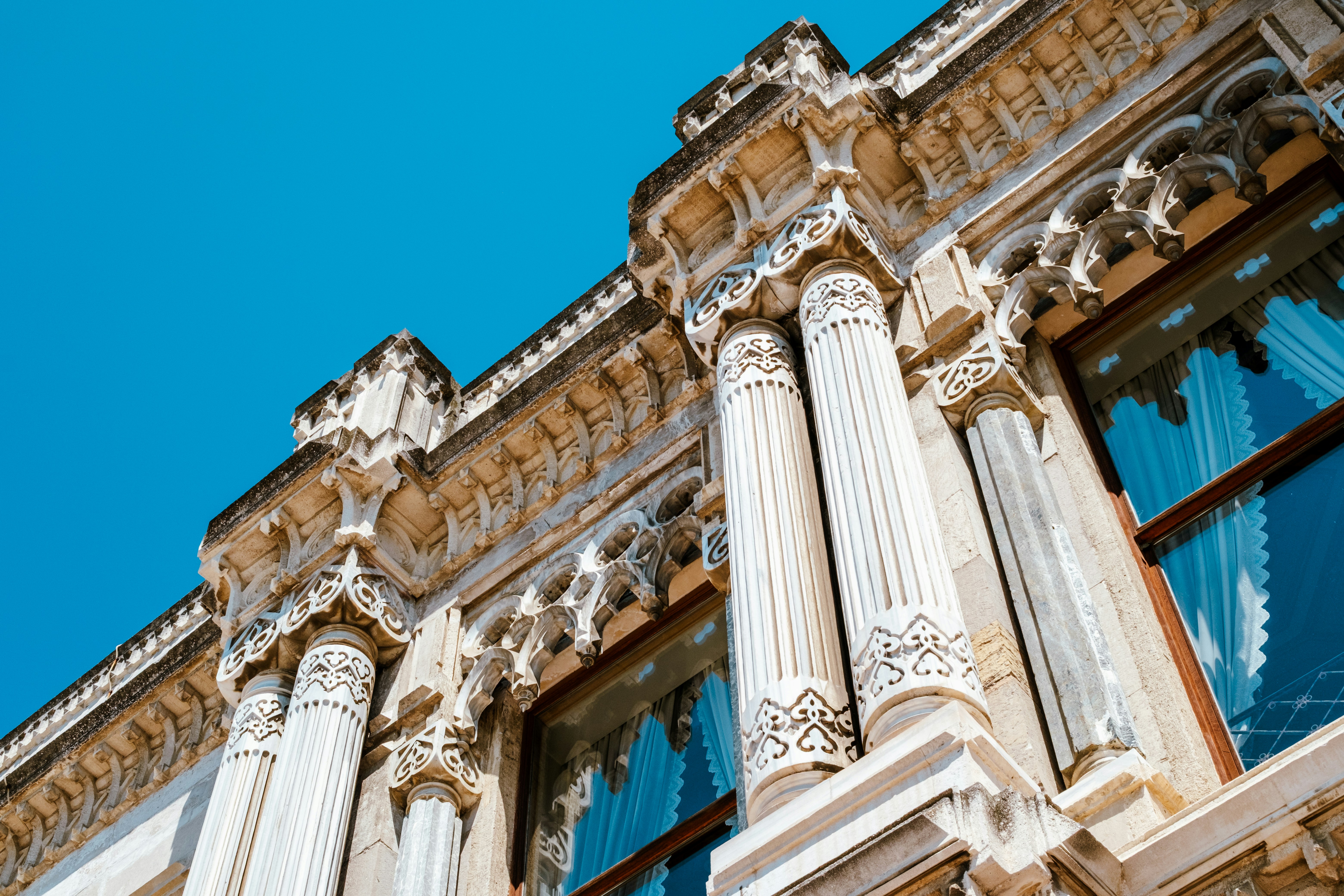 Ornate Facade Rising Toward a Clear Blue Sky