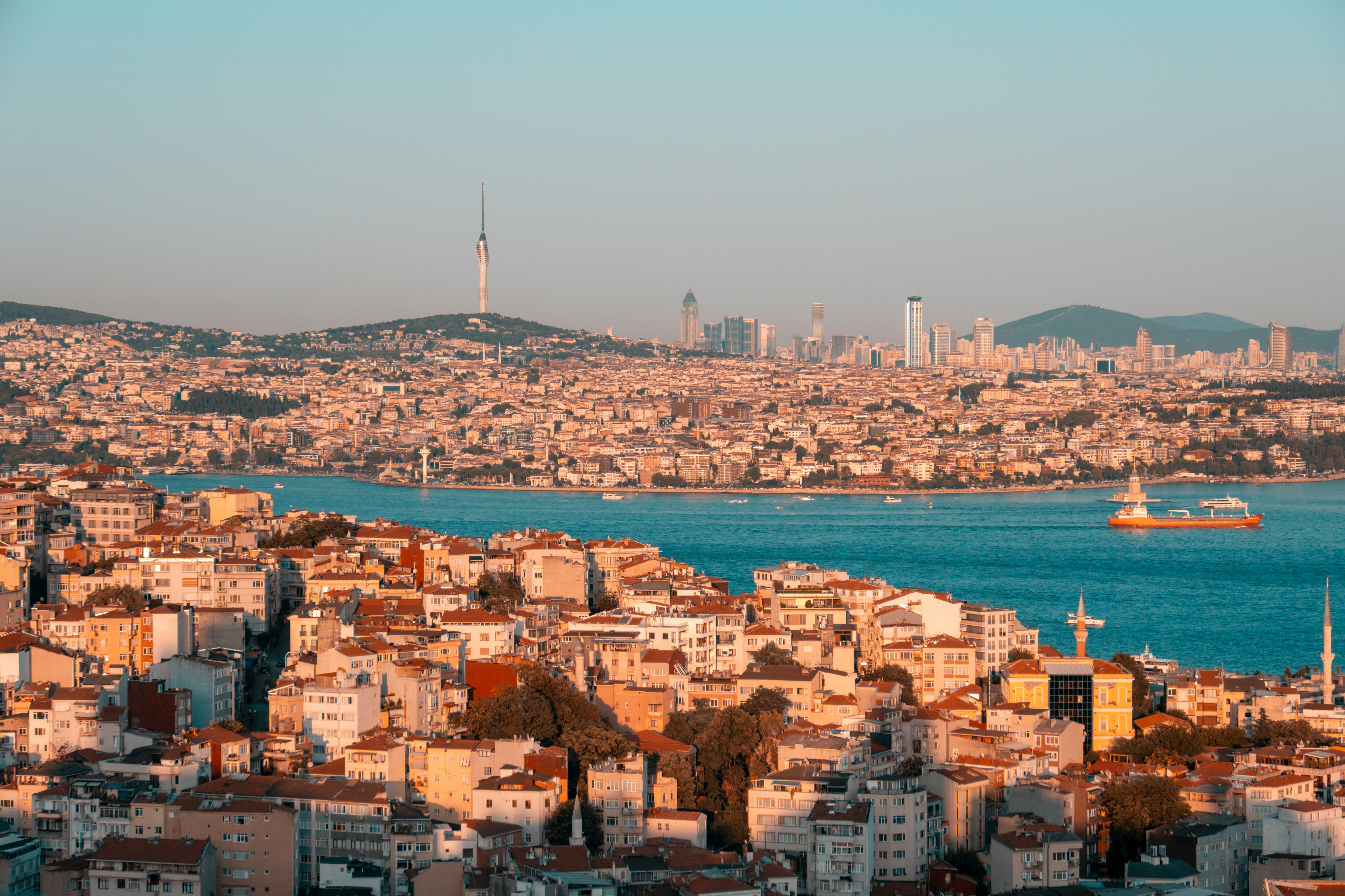 Sunlit Bay and Hillside Cityscape at Dusk