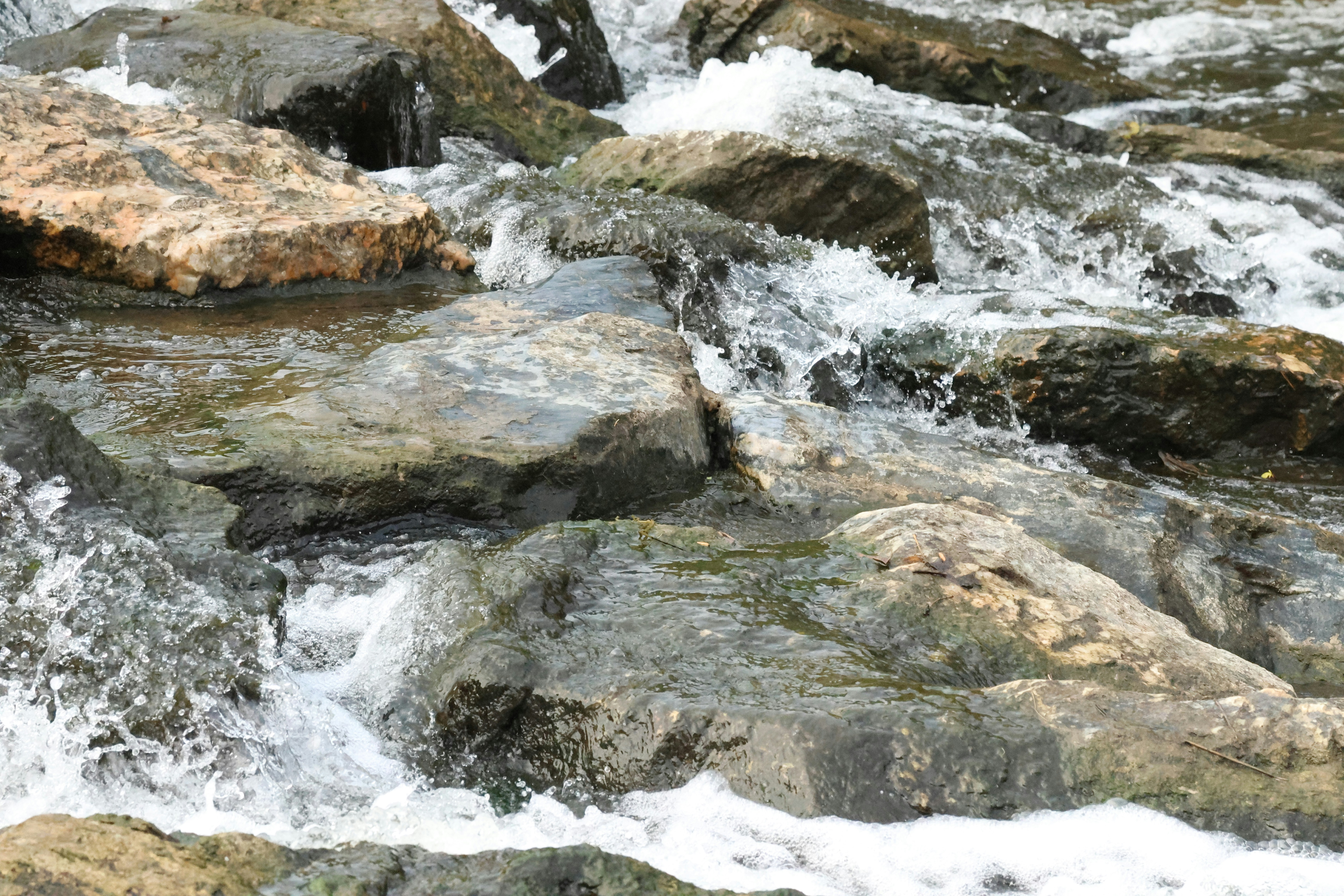 Rushing Light Across Wet Granite