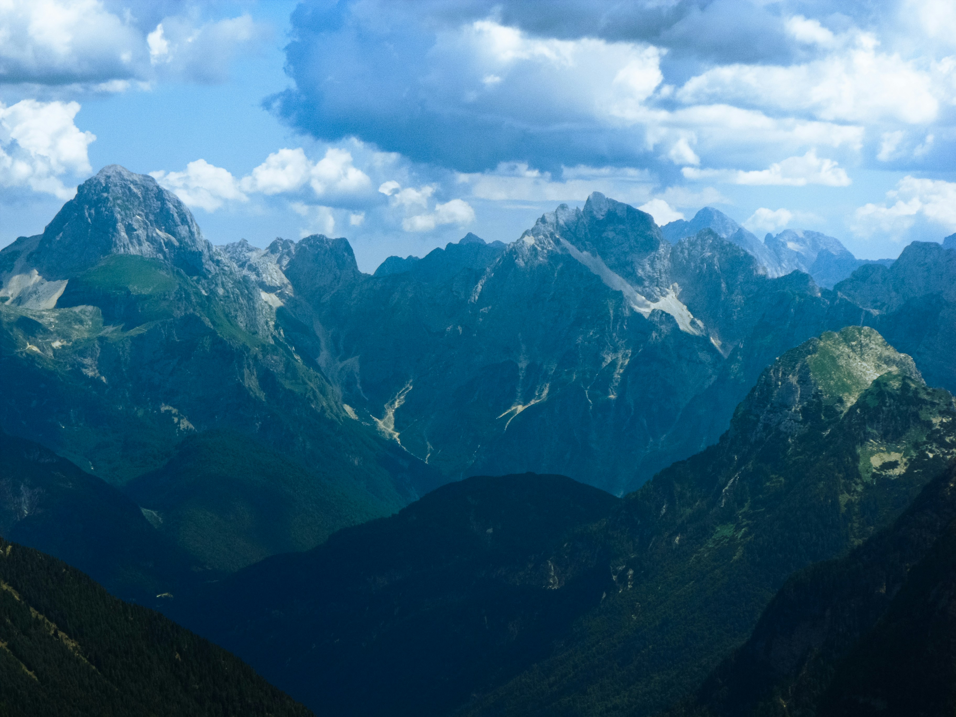 Majestic Alpine Promise: A Cascade of Peaks under Open Sky