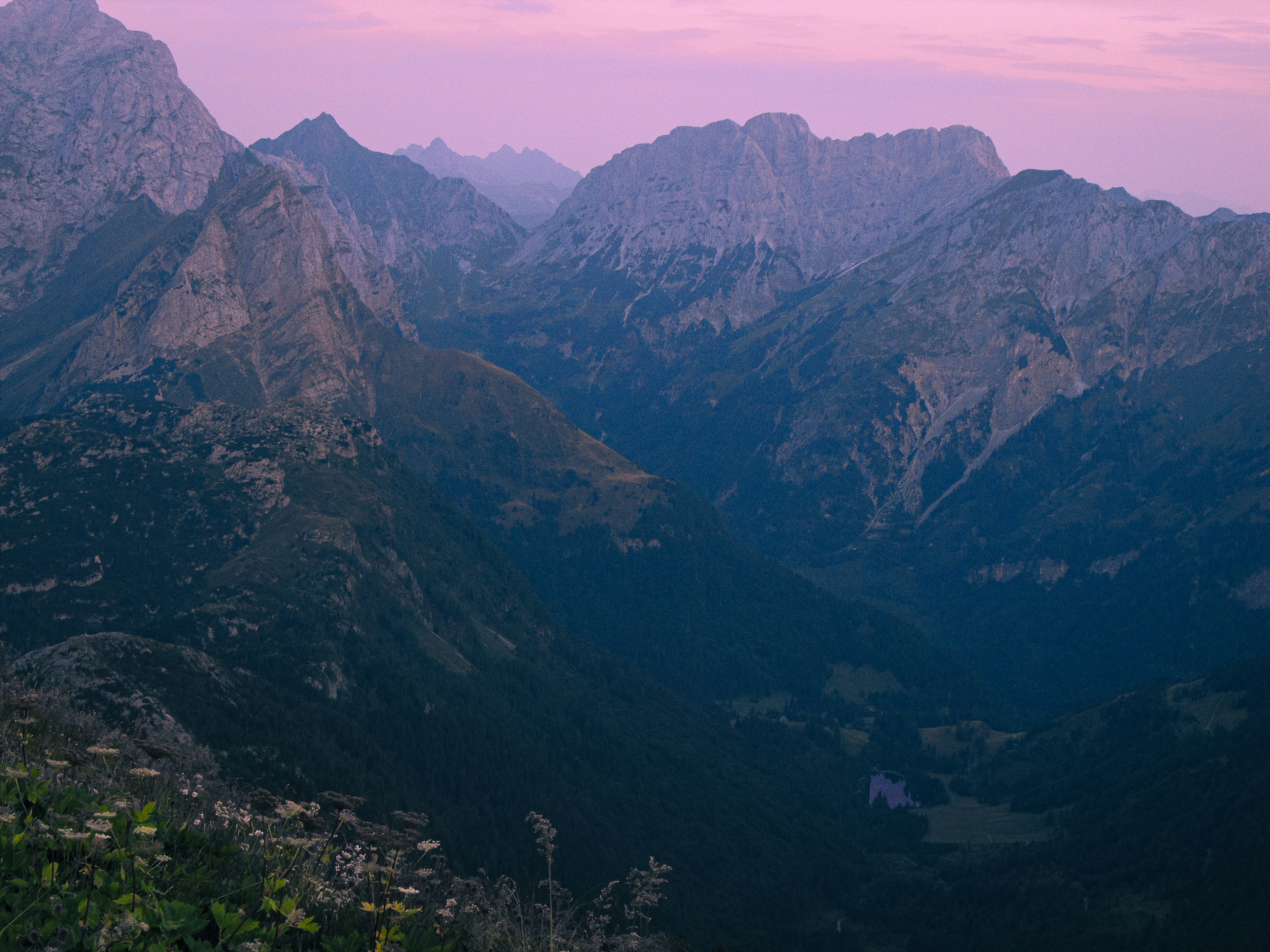 Distant Ridge Under a Pink Dusk Sky