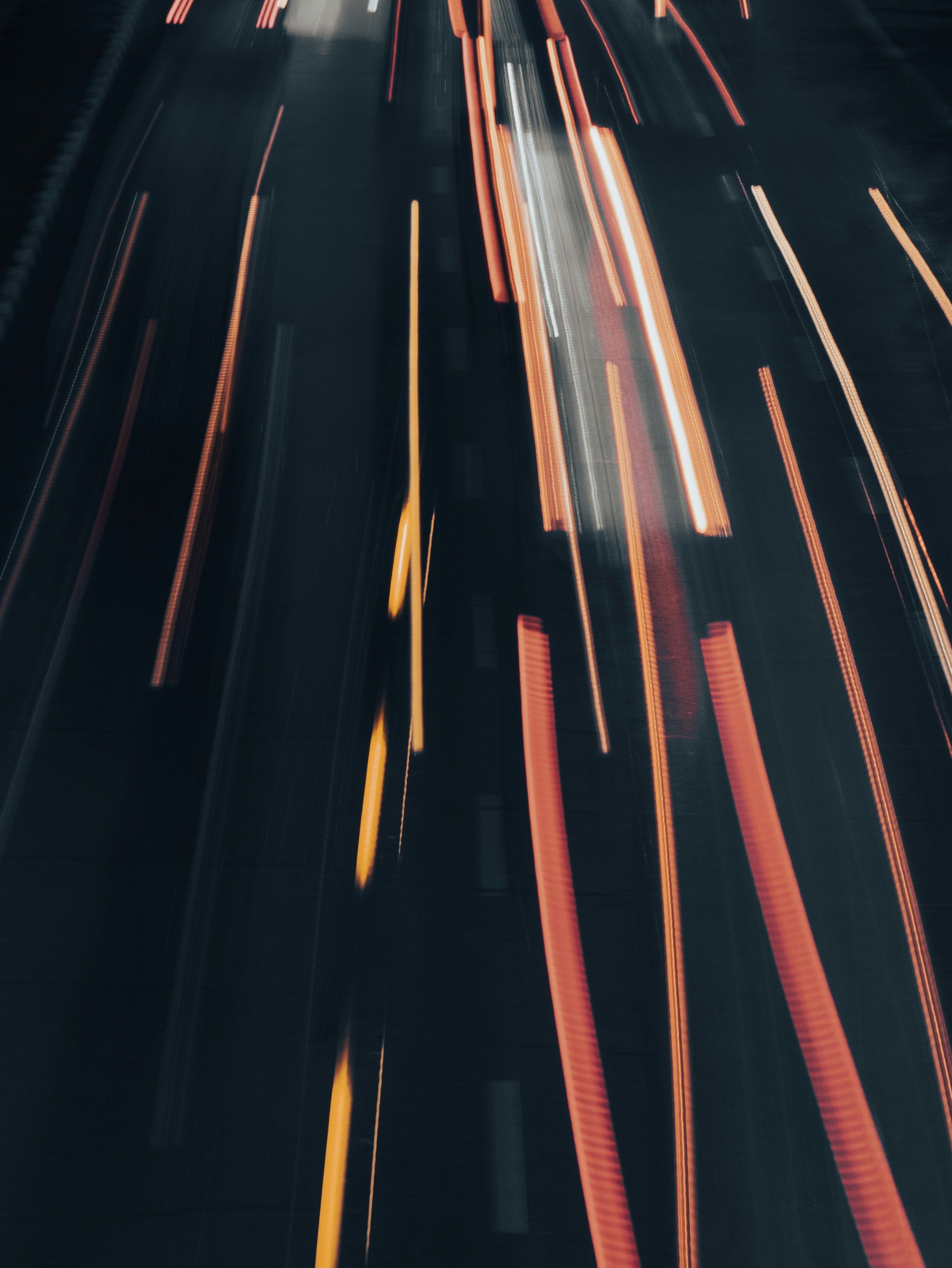 Streaks in Motion: Neon Arteries of Night Traffic
