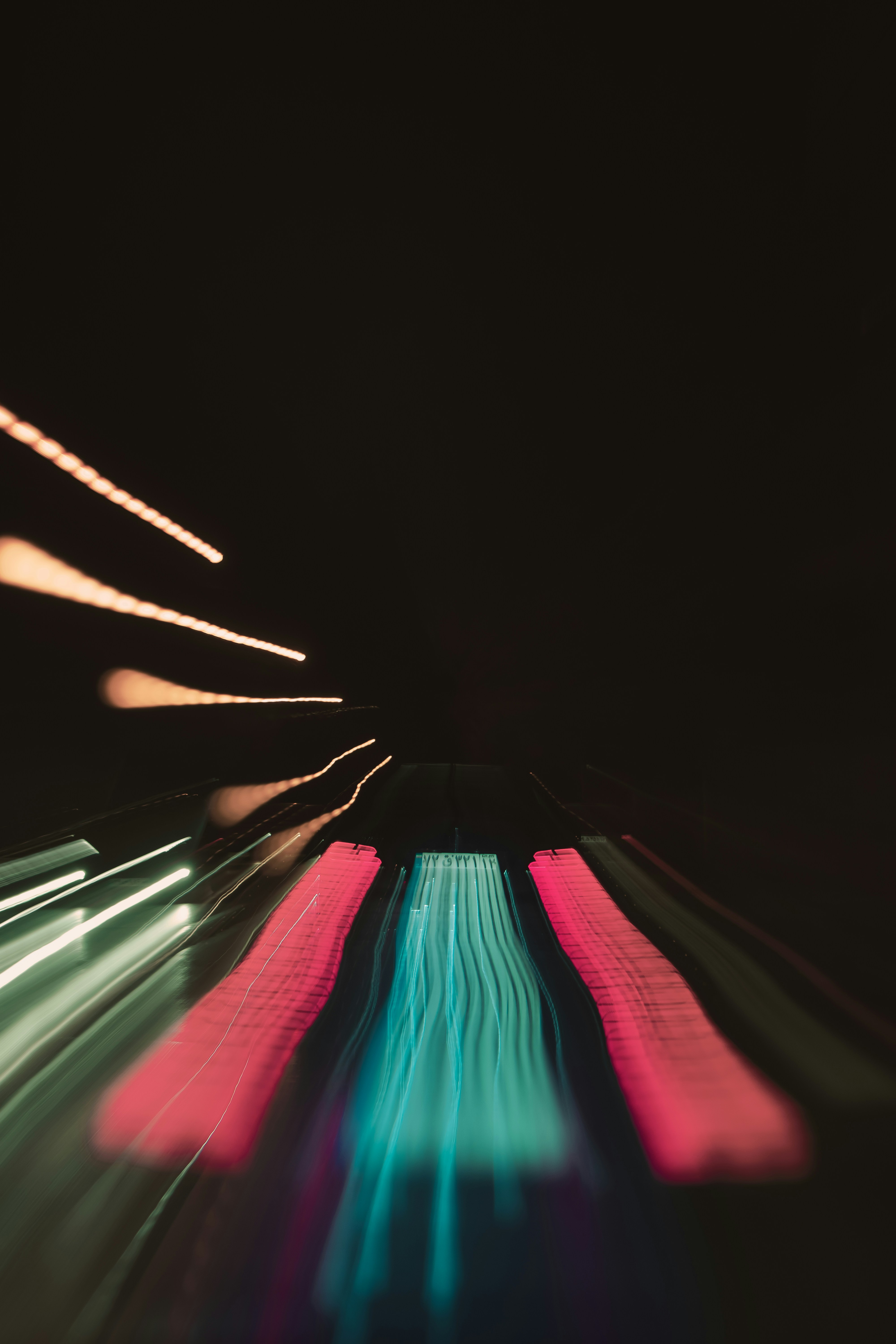 Neon Streaks: A Night Drive Through Colorful Light Trails