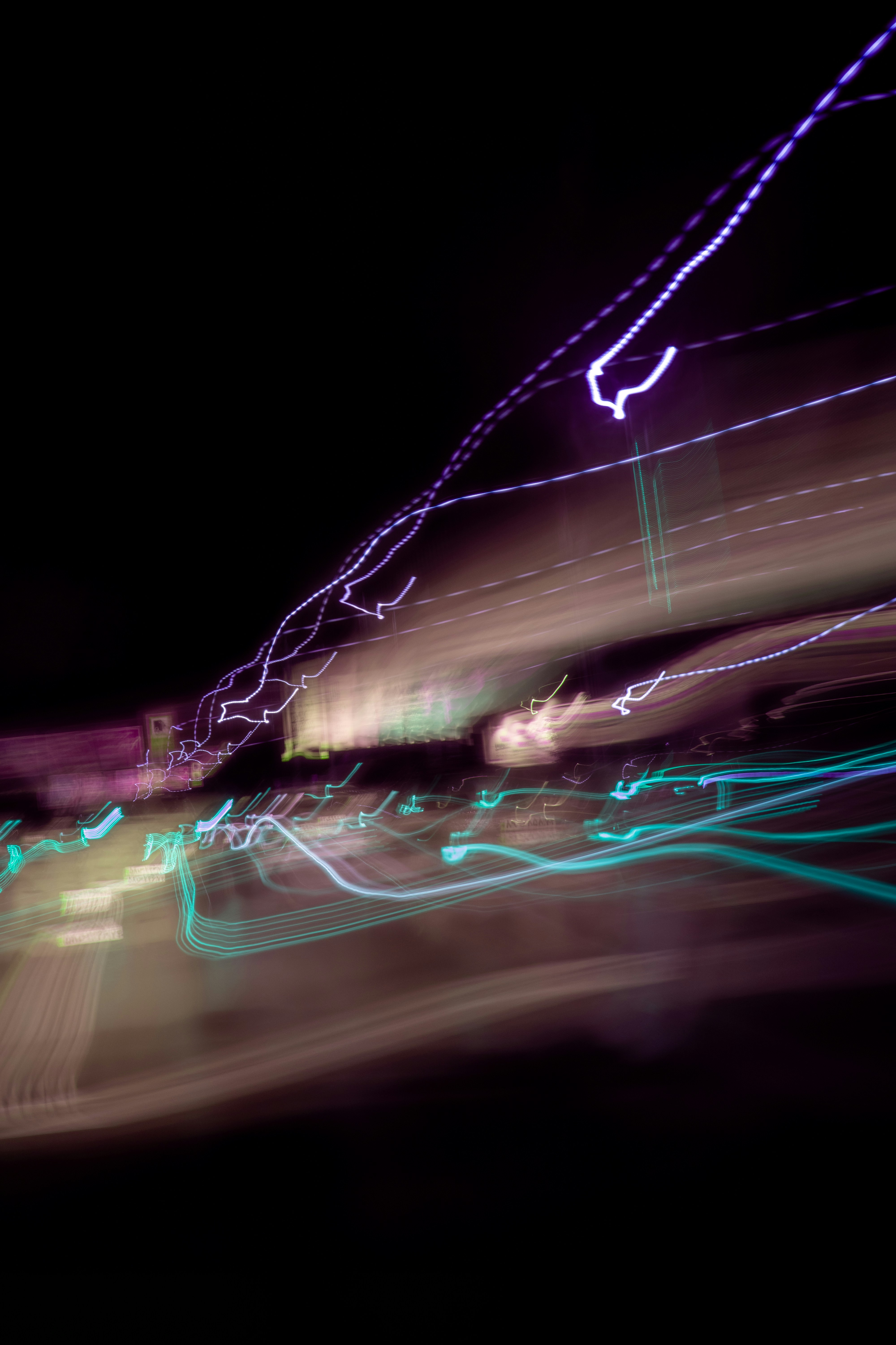 Neon Collision: Night Street Lights in a Blur of Motion