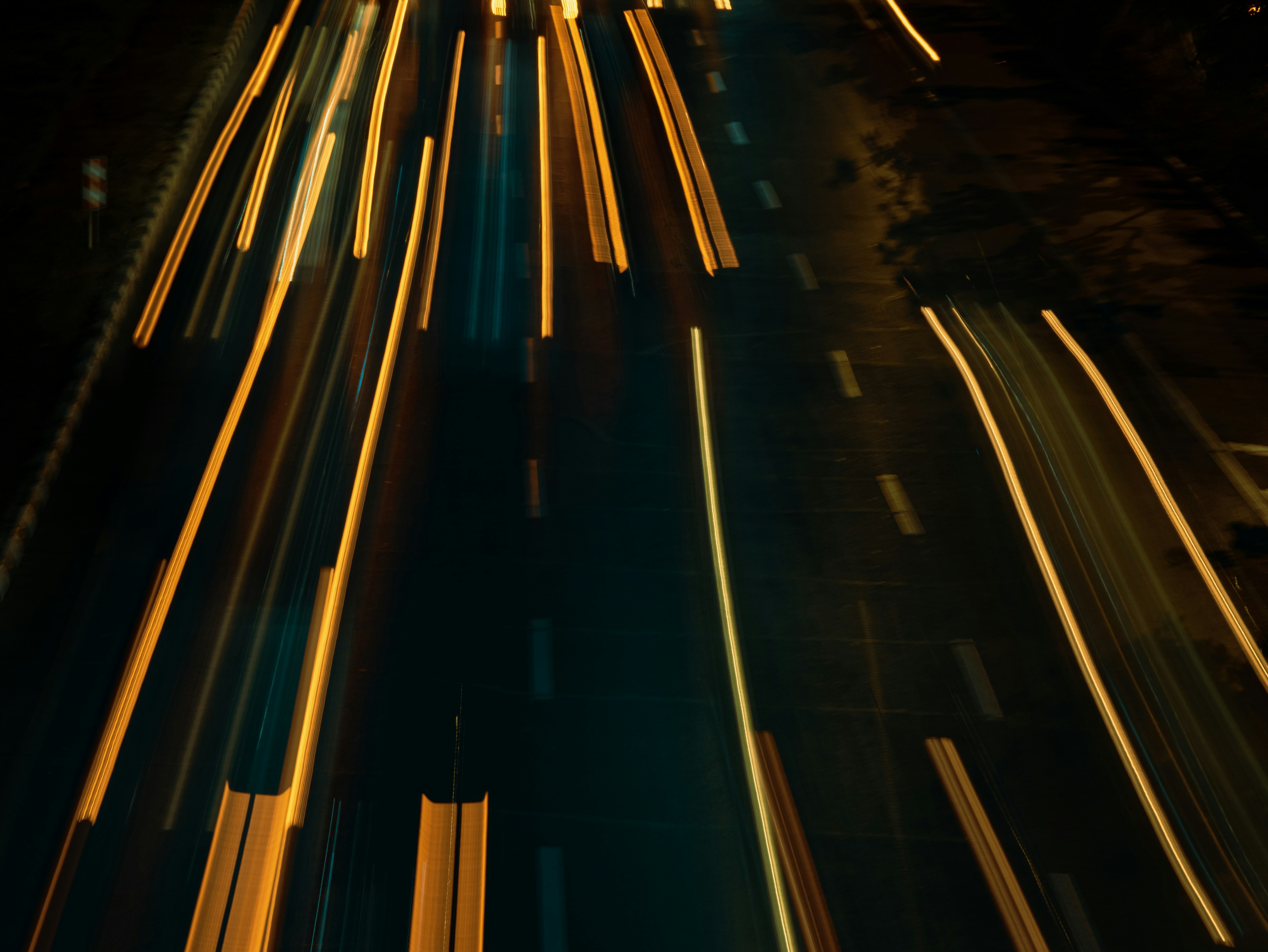 Trailing Neon: Night Roadlines in Motion