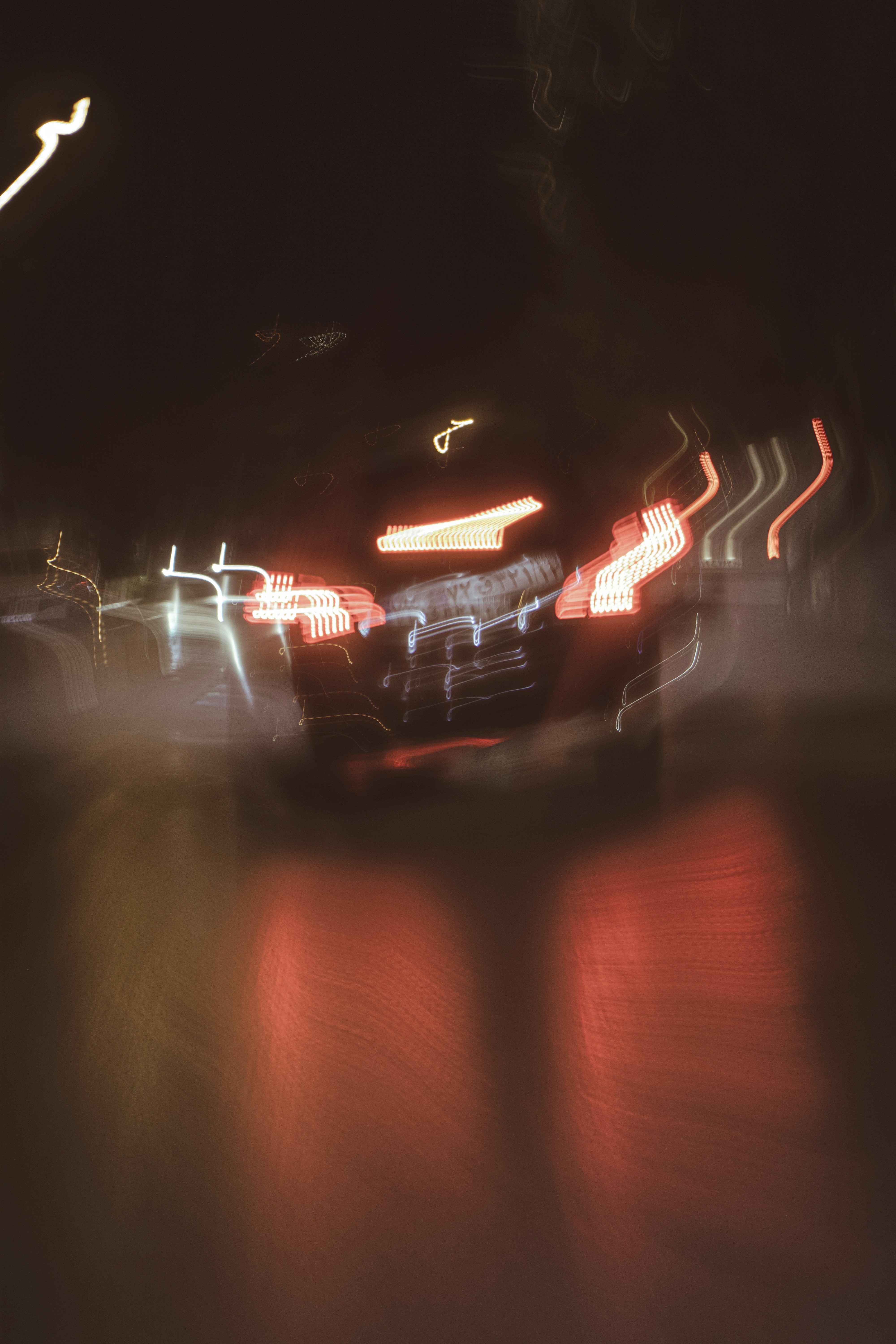 Night Drive in Motion Blur: Neon Trails on Wet Asphalt