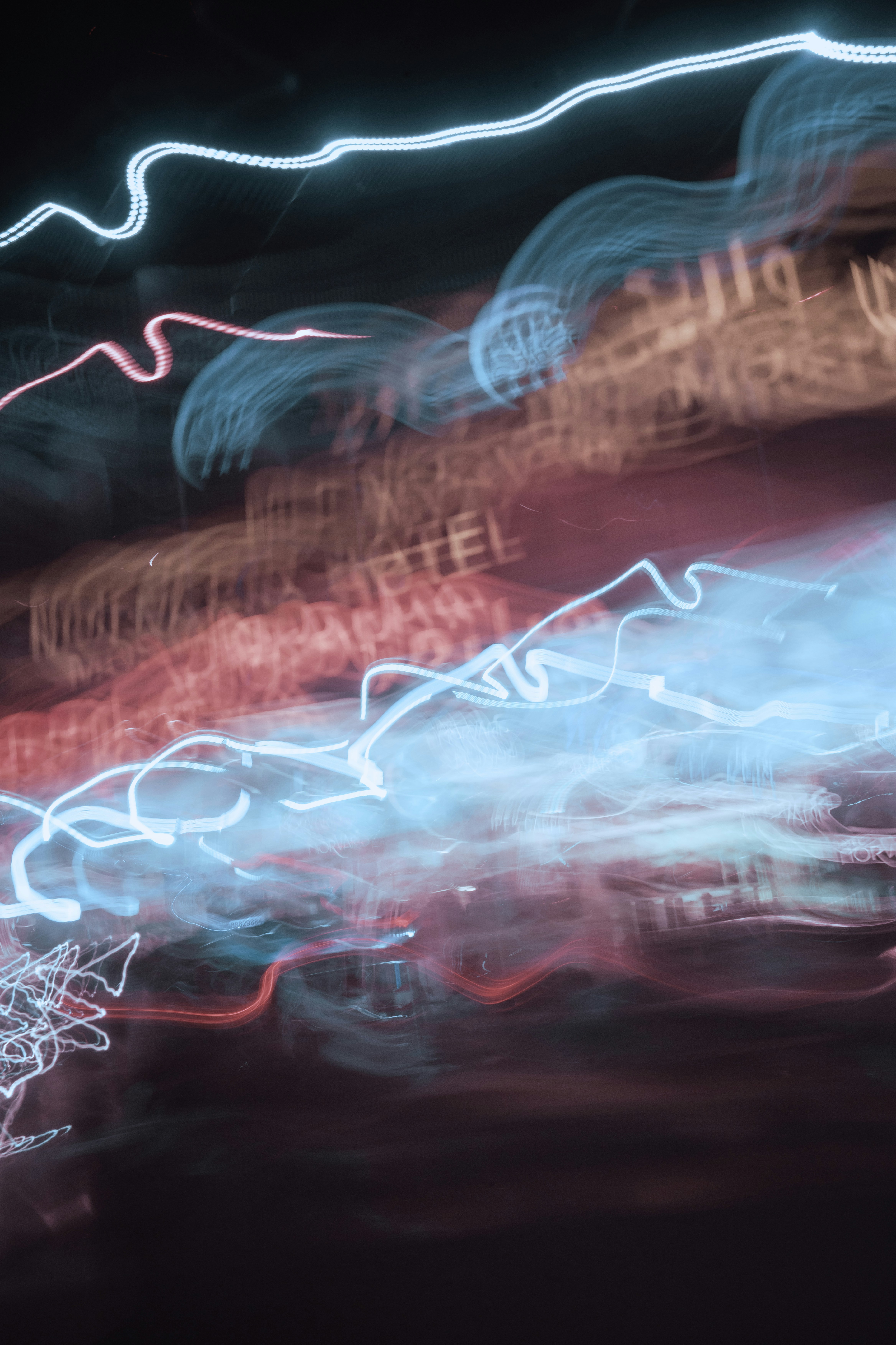 Neon Whorls in Motion: Velocity of Light Paint on Night Street