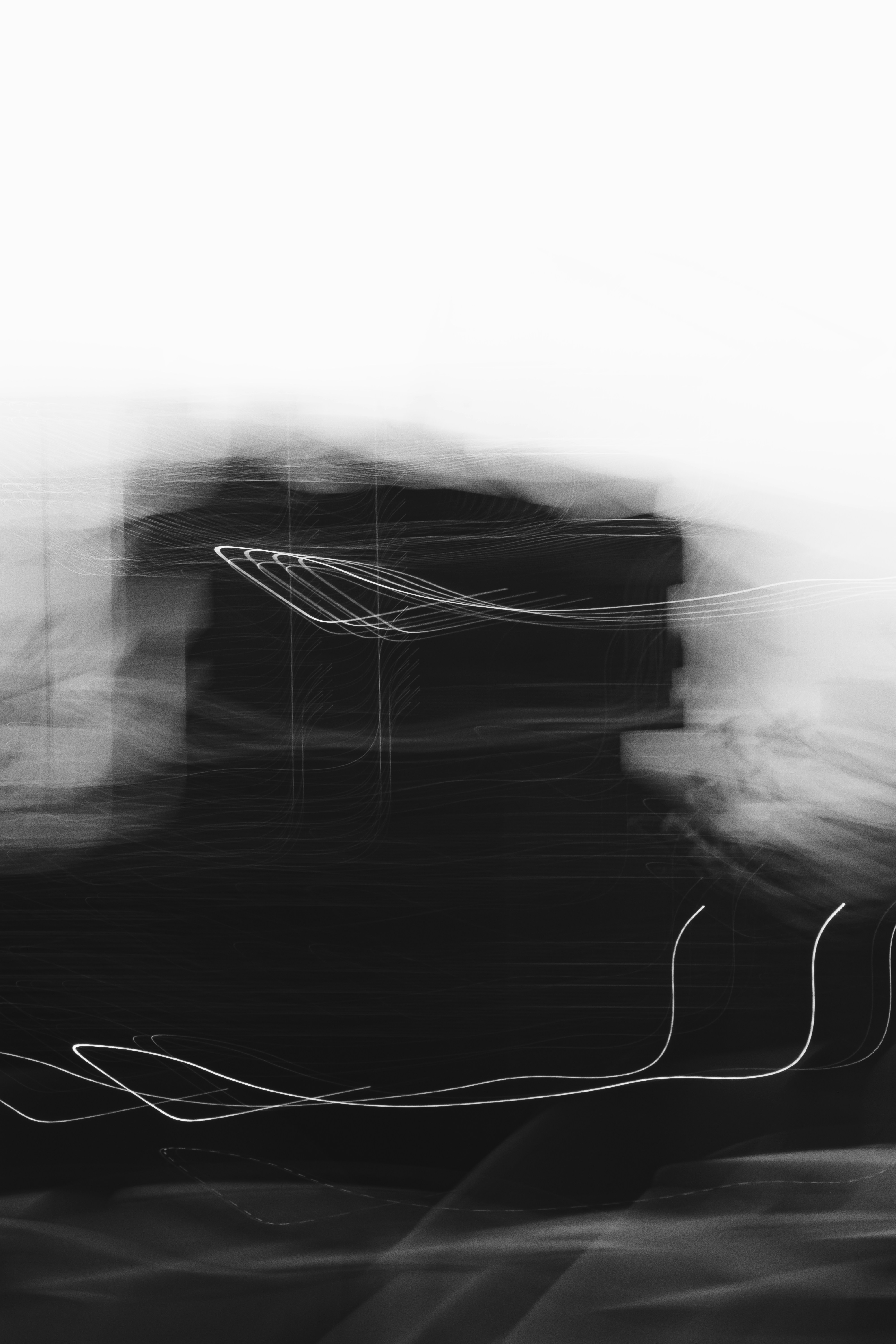 Blurred Echoes: A Dark, Motion-Drawn Structure in Monochrome
