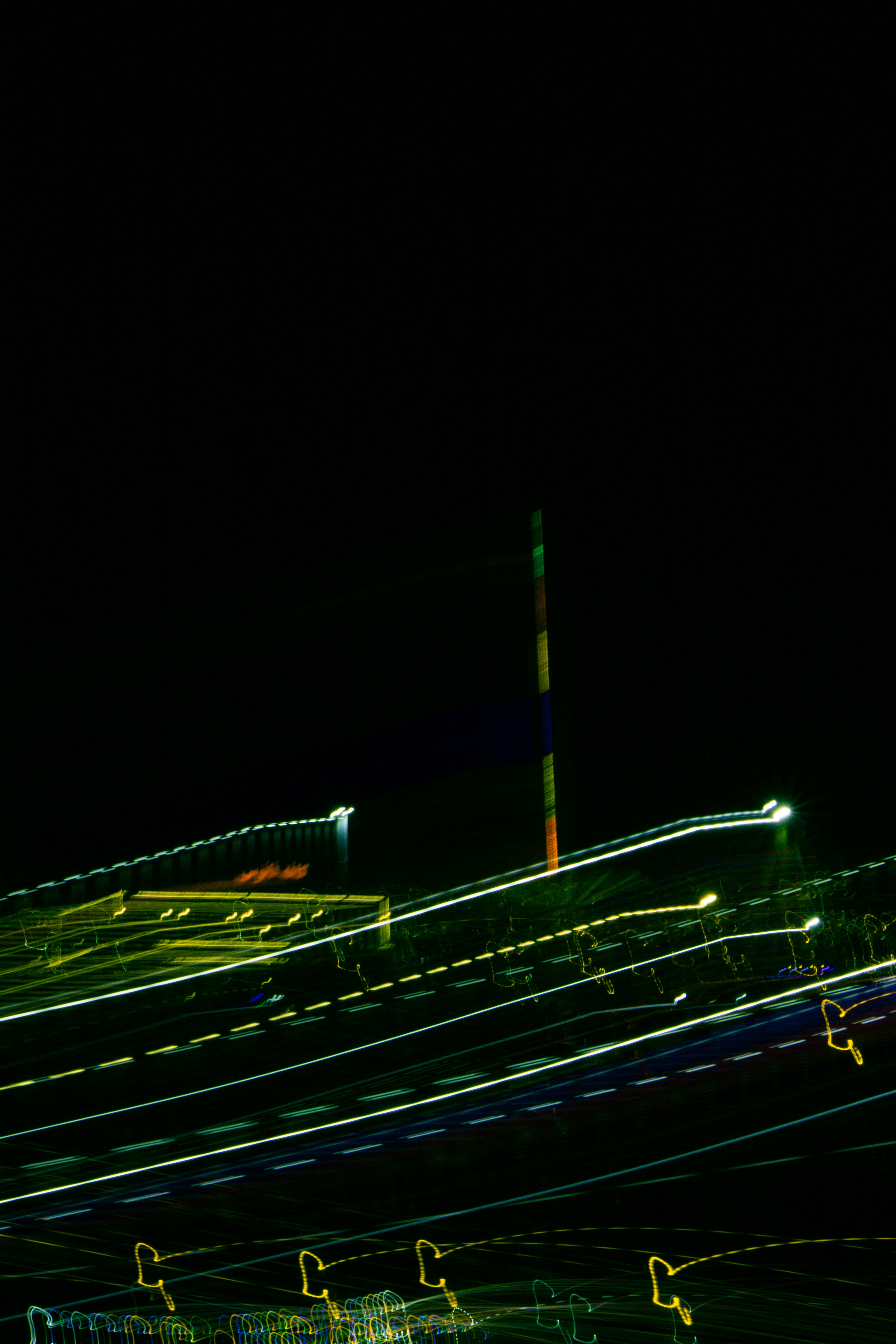 Neon Streaks Under Night Sky