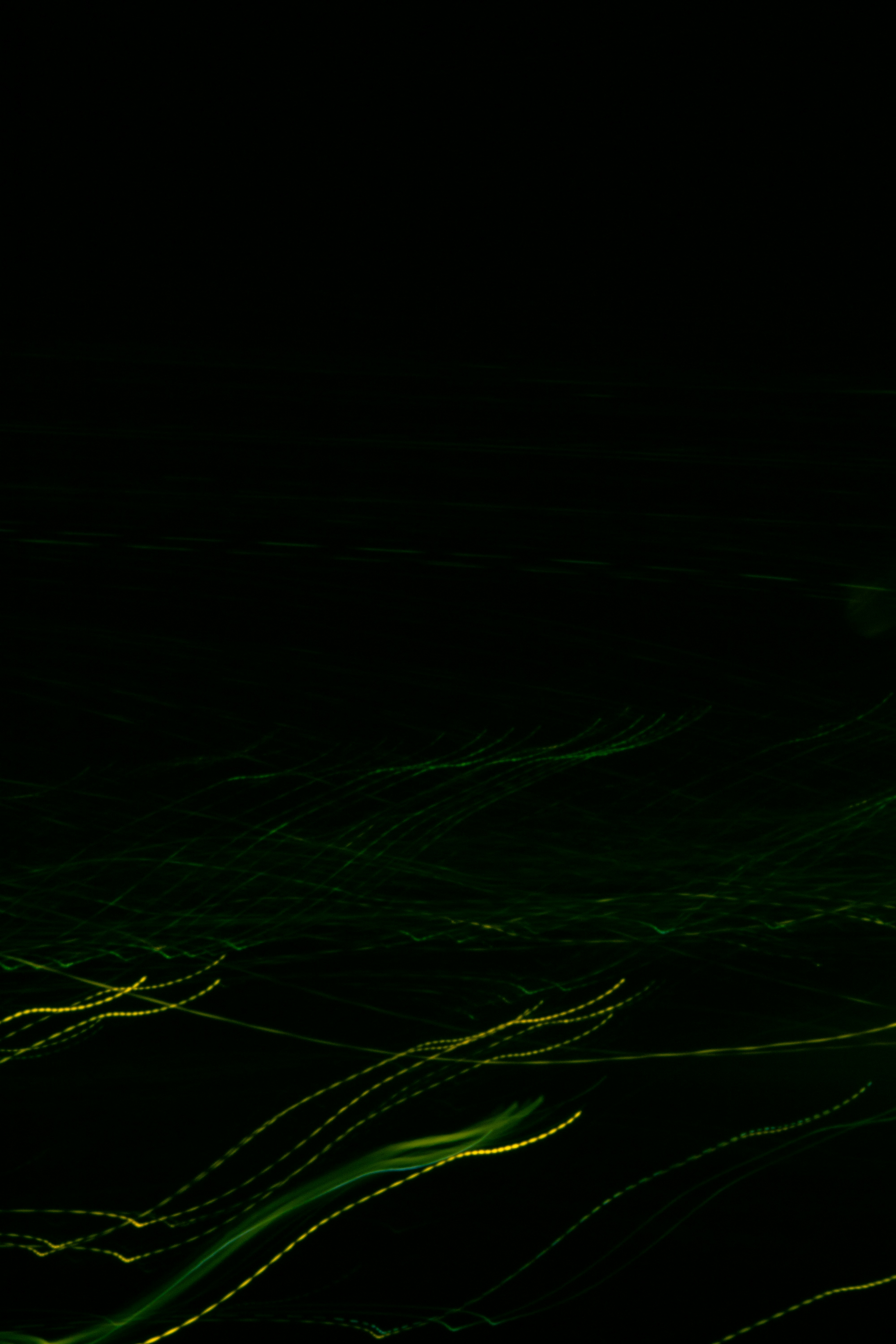 Green Night Trails: Neon Streaks Across a Velvet Dark