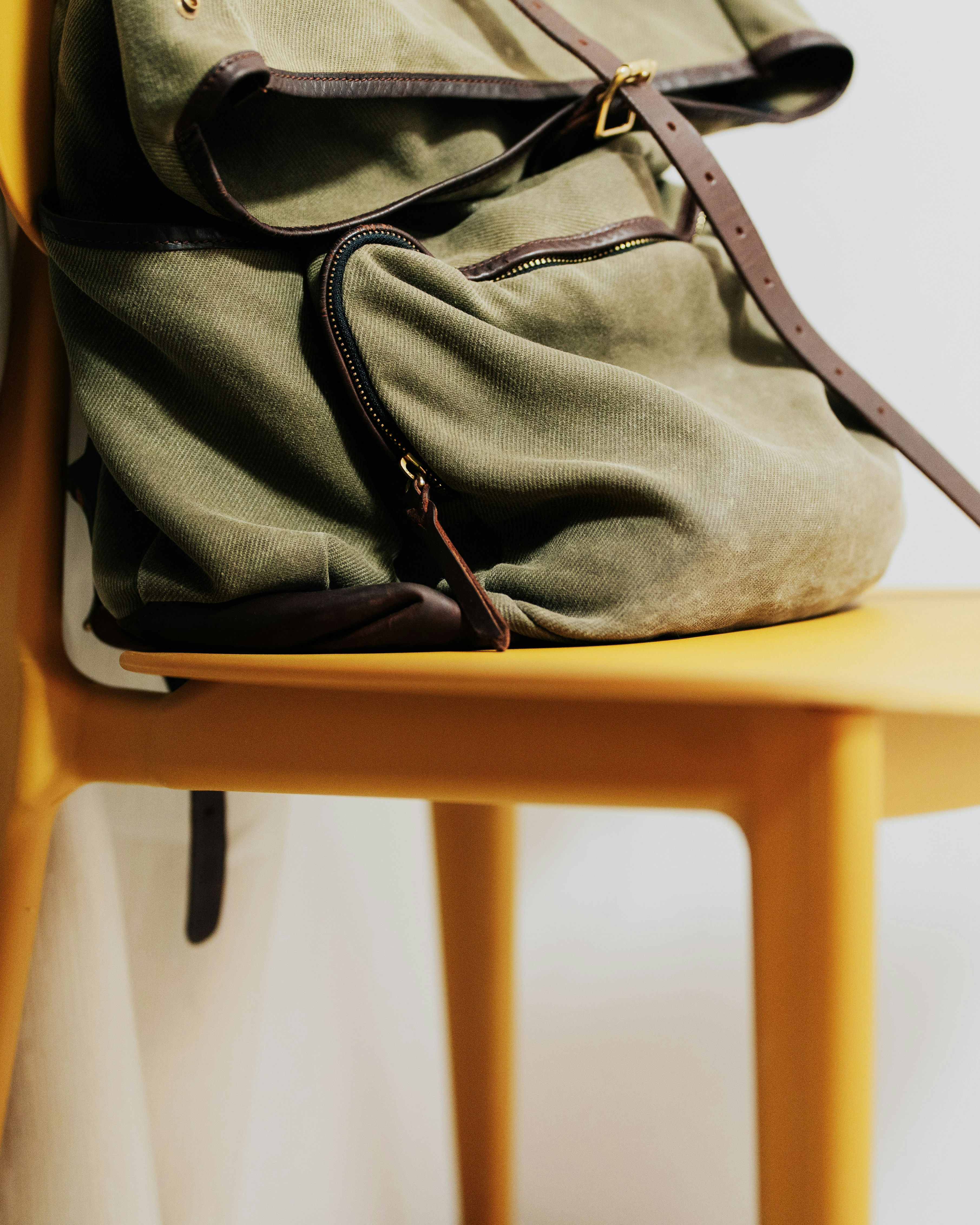 Olive Pack on Sunny Stool: A Quiet Study in Texture and Color