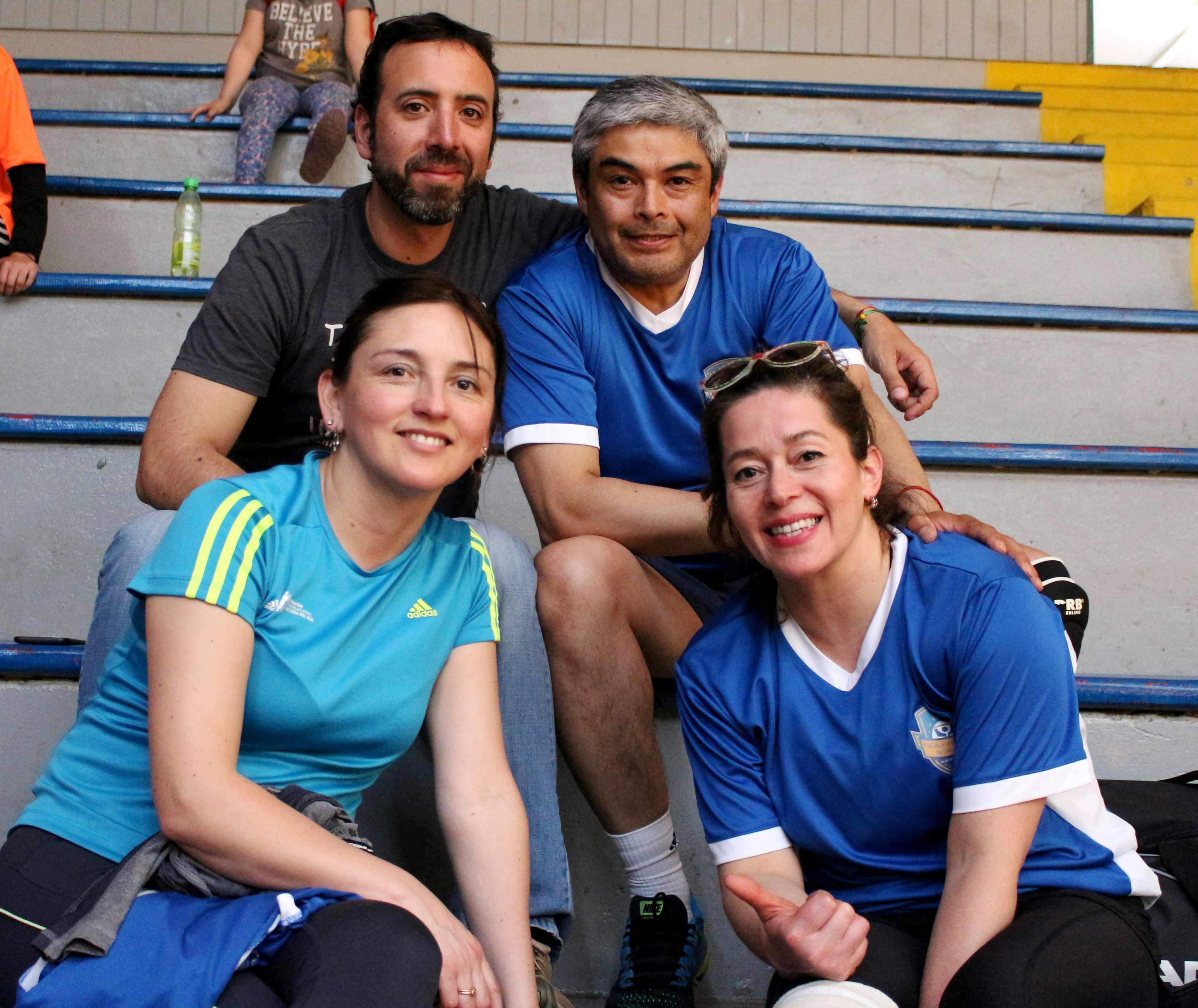 Team Portrait at the Bleachers: Friends in Cheerful Camaraderie