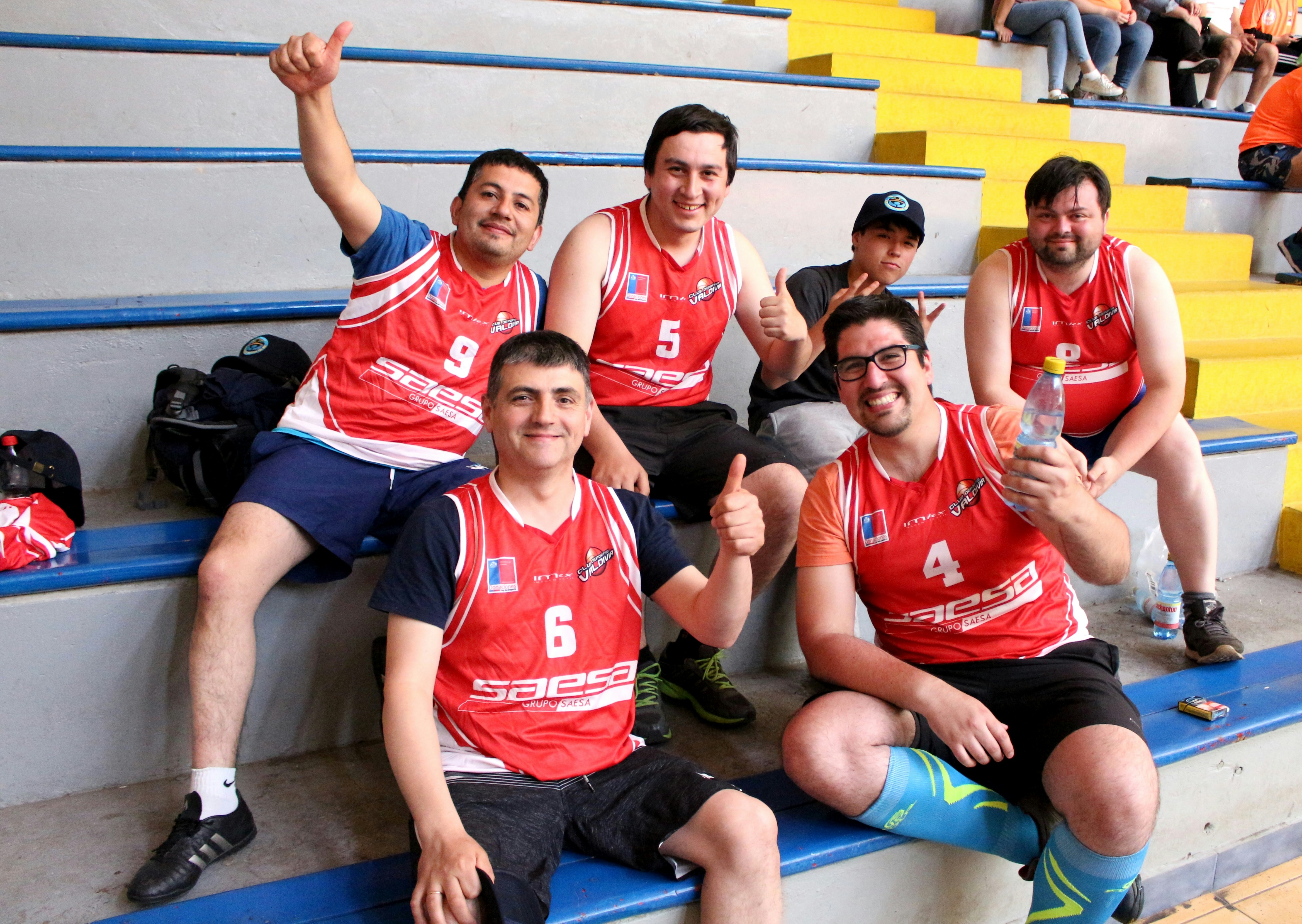 Team Victory on the Bleachers: Red Jerseys and Cheers