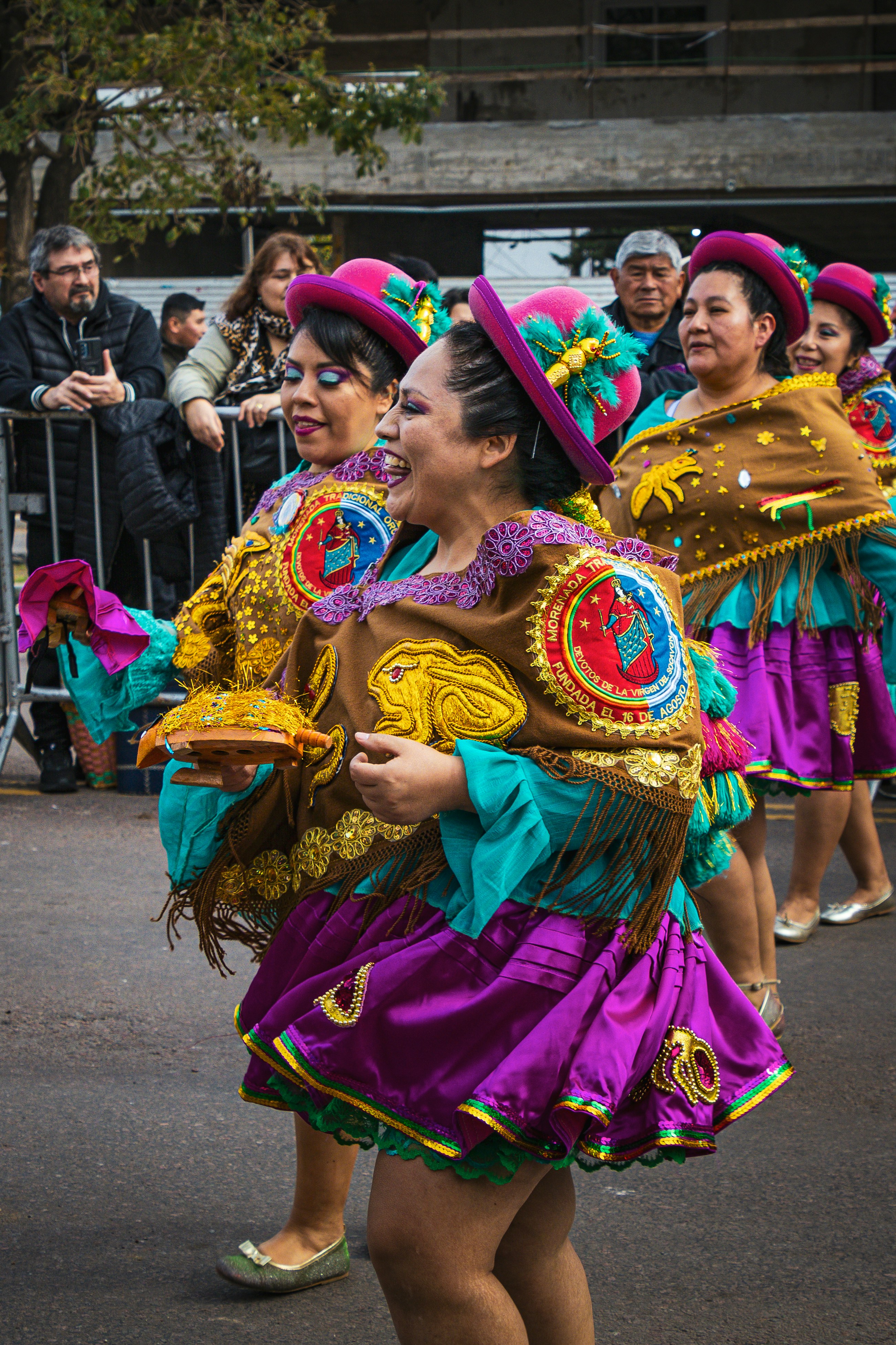 Joyful Moment in Color: Dancers Parade in Vibrant Fiesta Attire