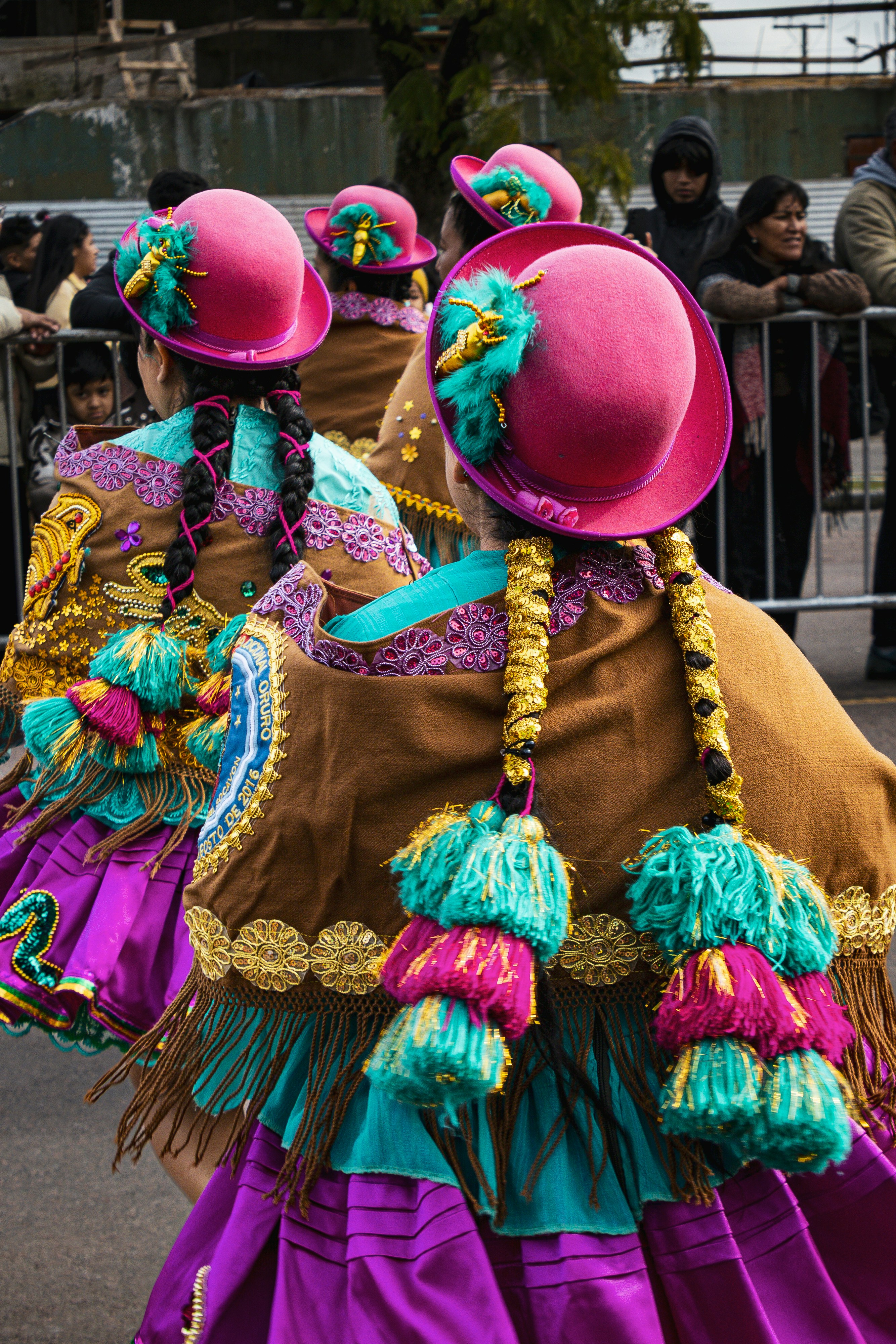 Vibrant Pachamama Parade: Colorful Attire in Motion
