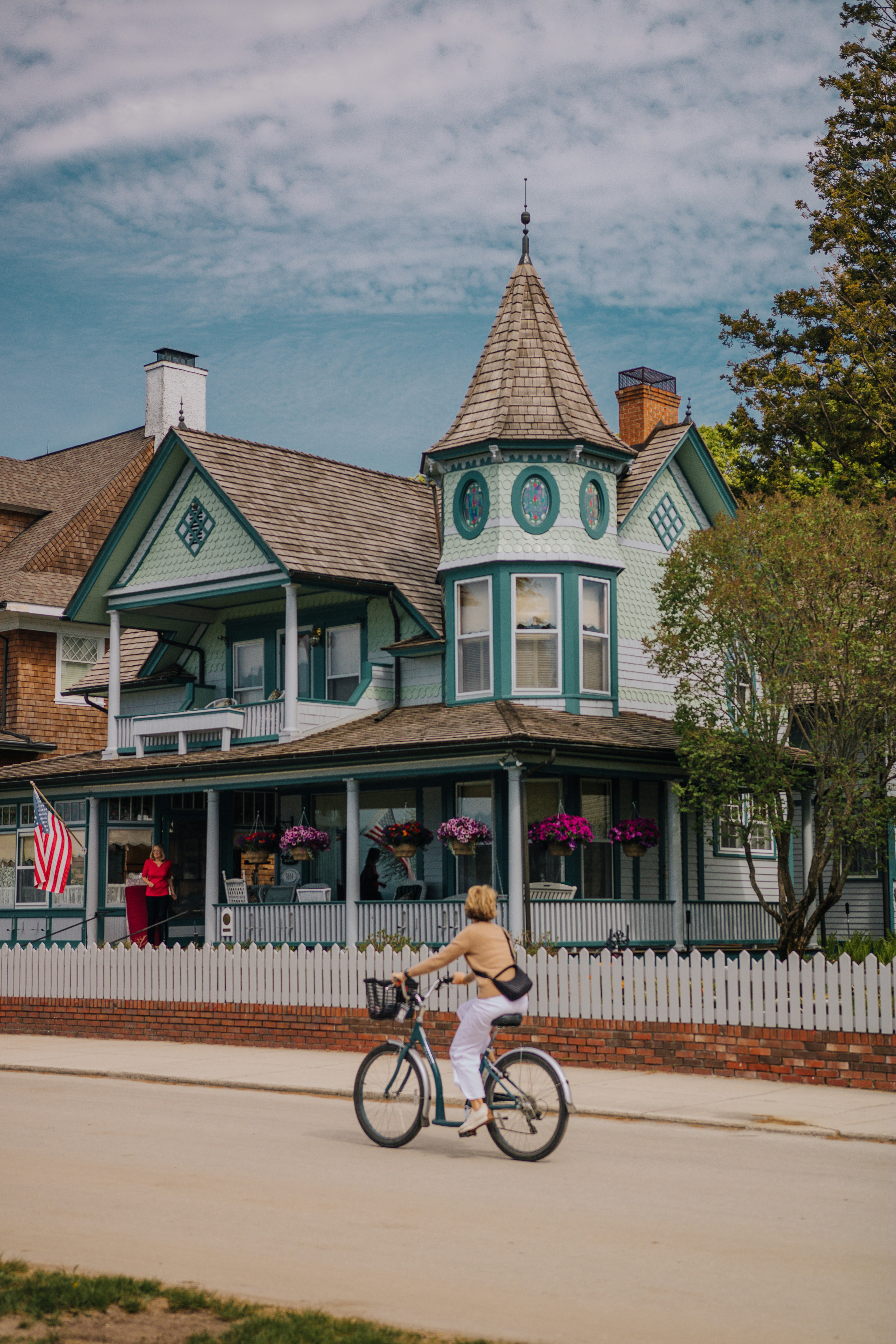 Pastel Victorian on Main: A Sunlit Ride by the Porch